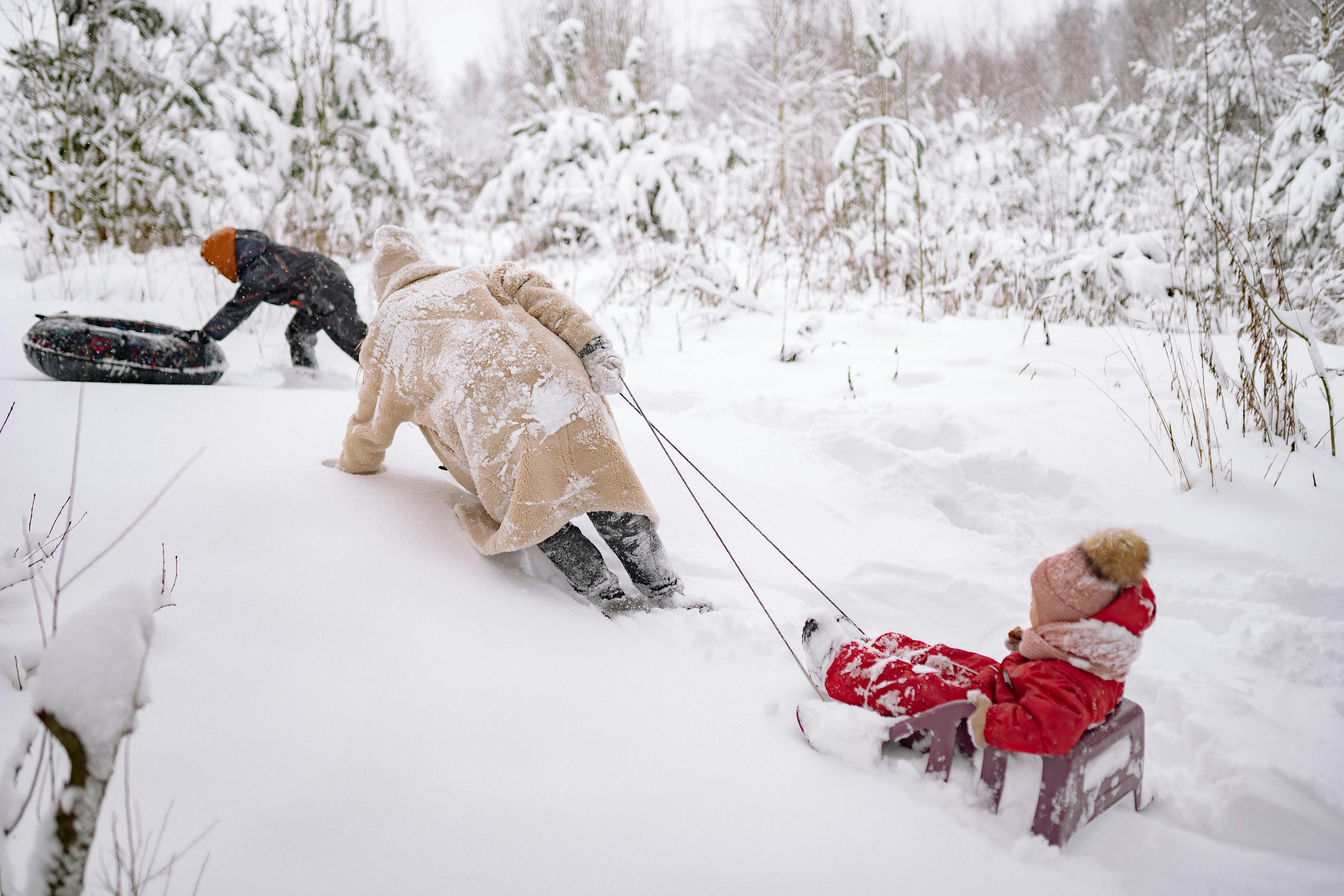 Kids Playing with Mother on Snow · Free Stock Photo