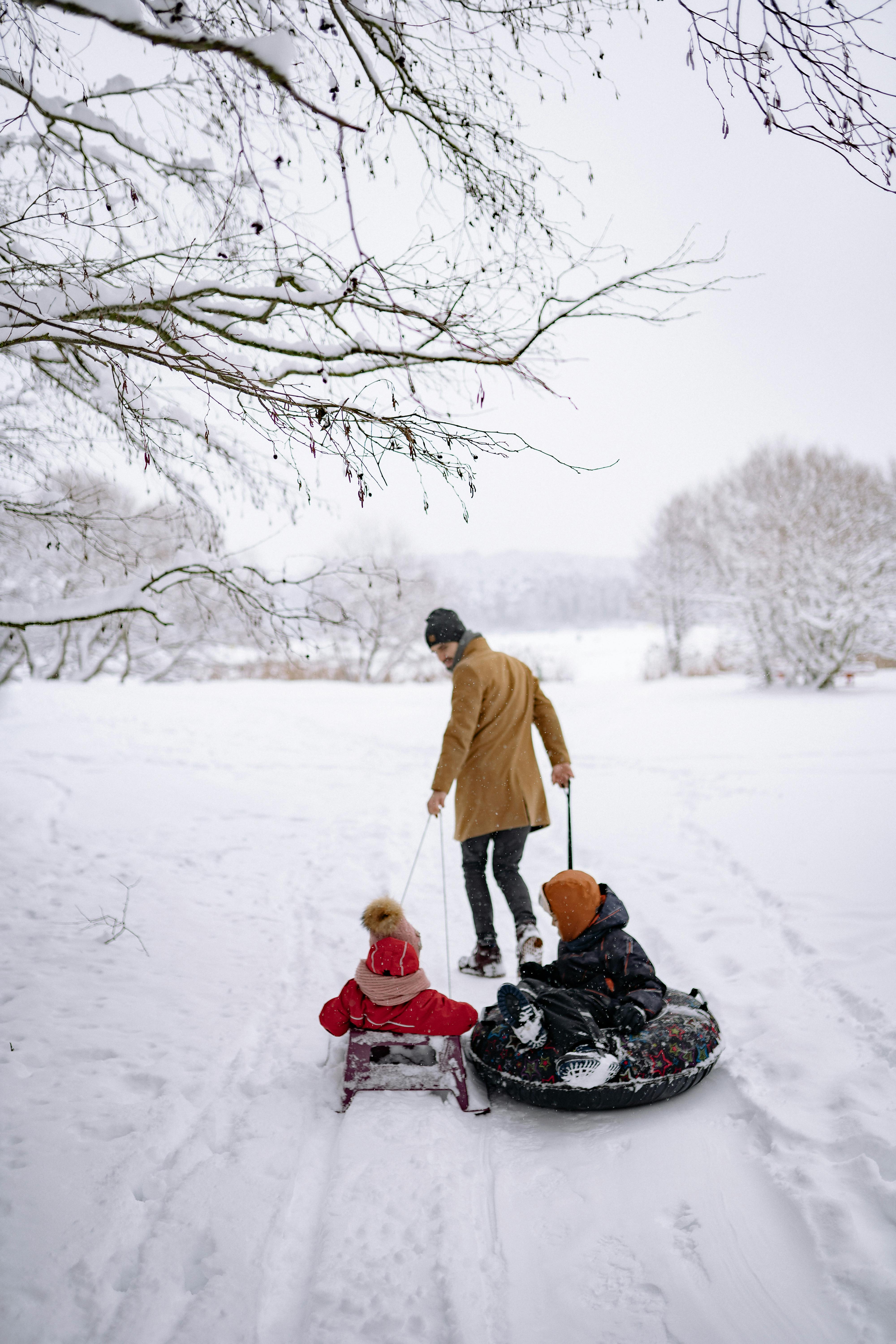 A Family Enjoying a Snow Fall · Free Stock Photo