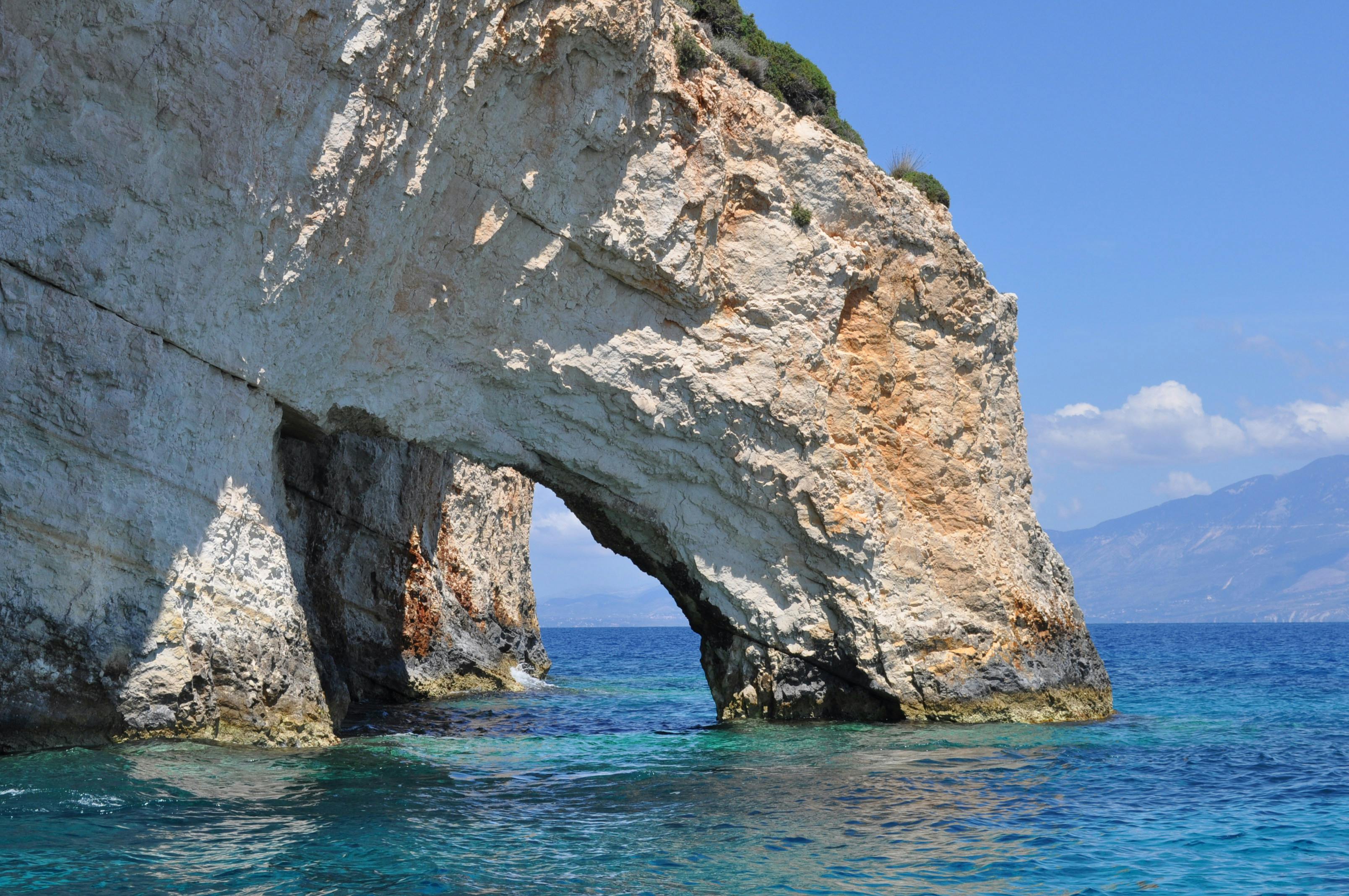 Green Rock Formation on the Ocean · Free Stock Photo