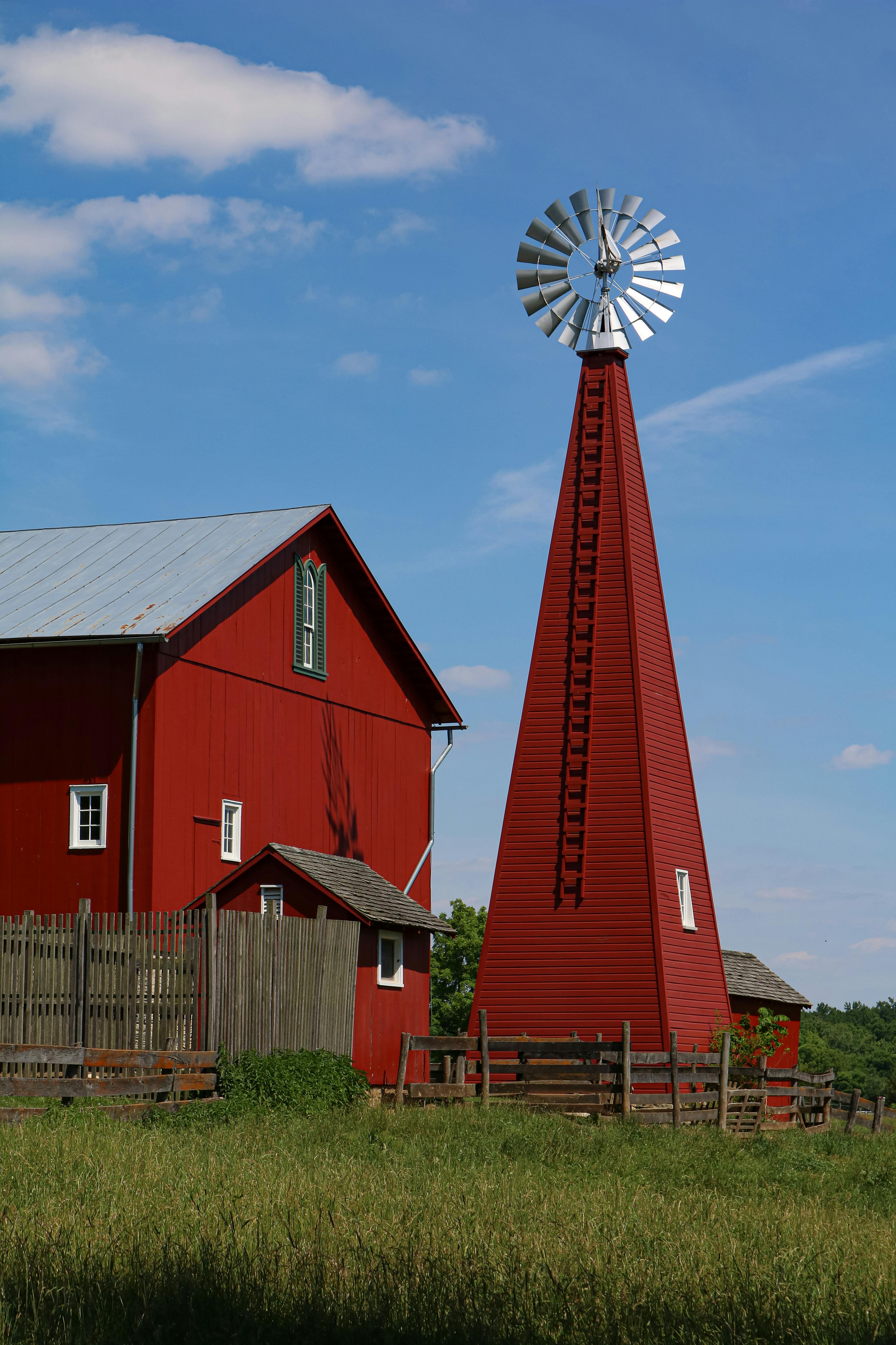 Red Barn and Windmill at a Farm · Free Stock Photo