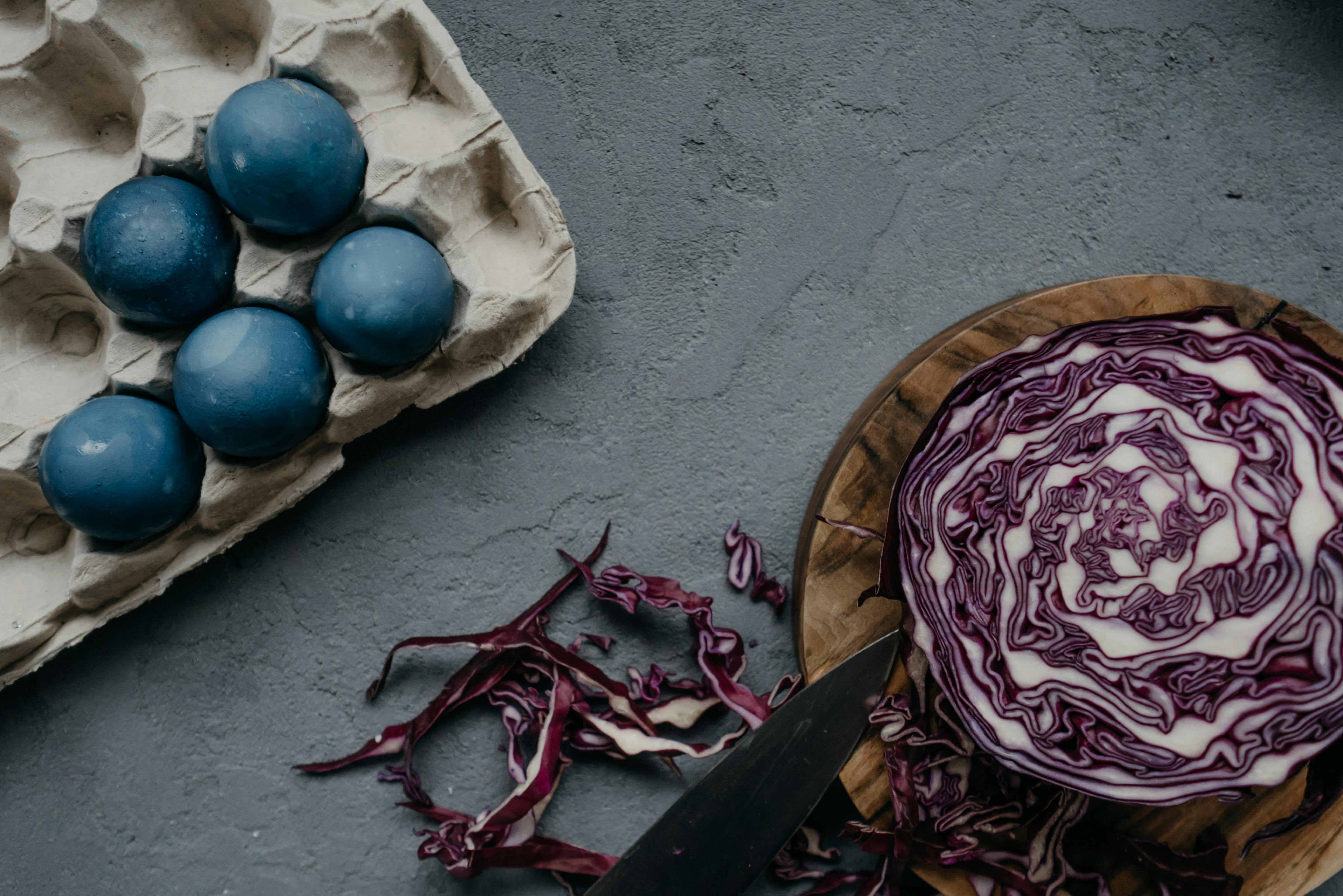 A Red Cabbage Near the Tray with Blue Eggs · Free Stock Photo