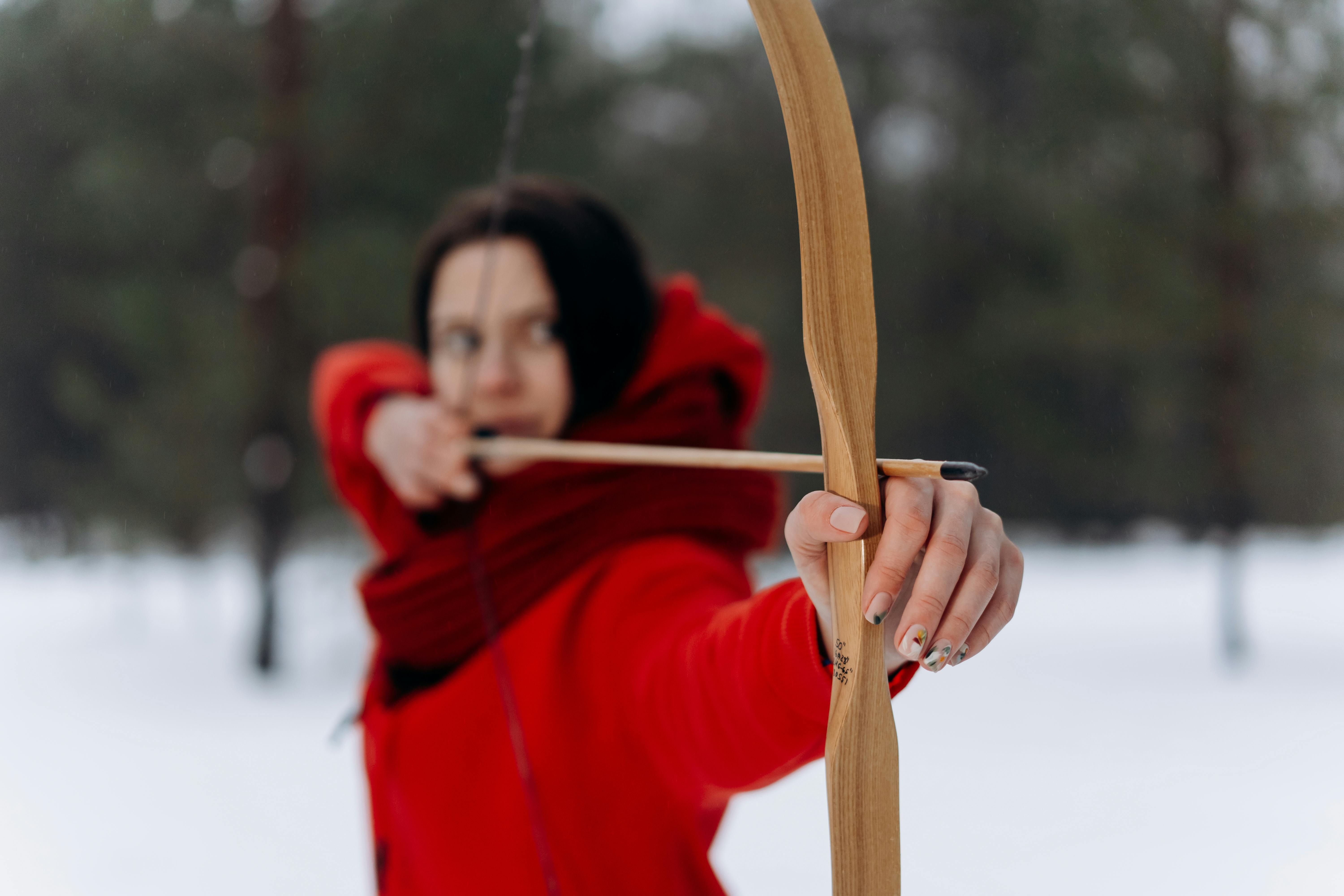Woman Using Wooden Bow · Free Stock Photo