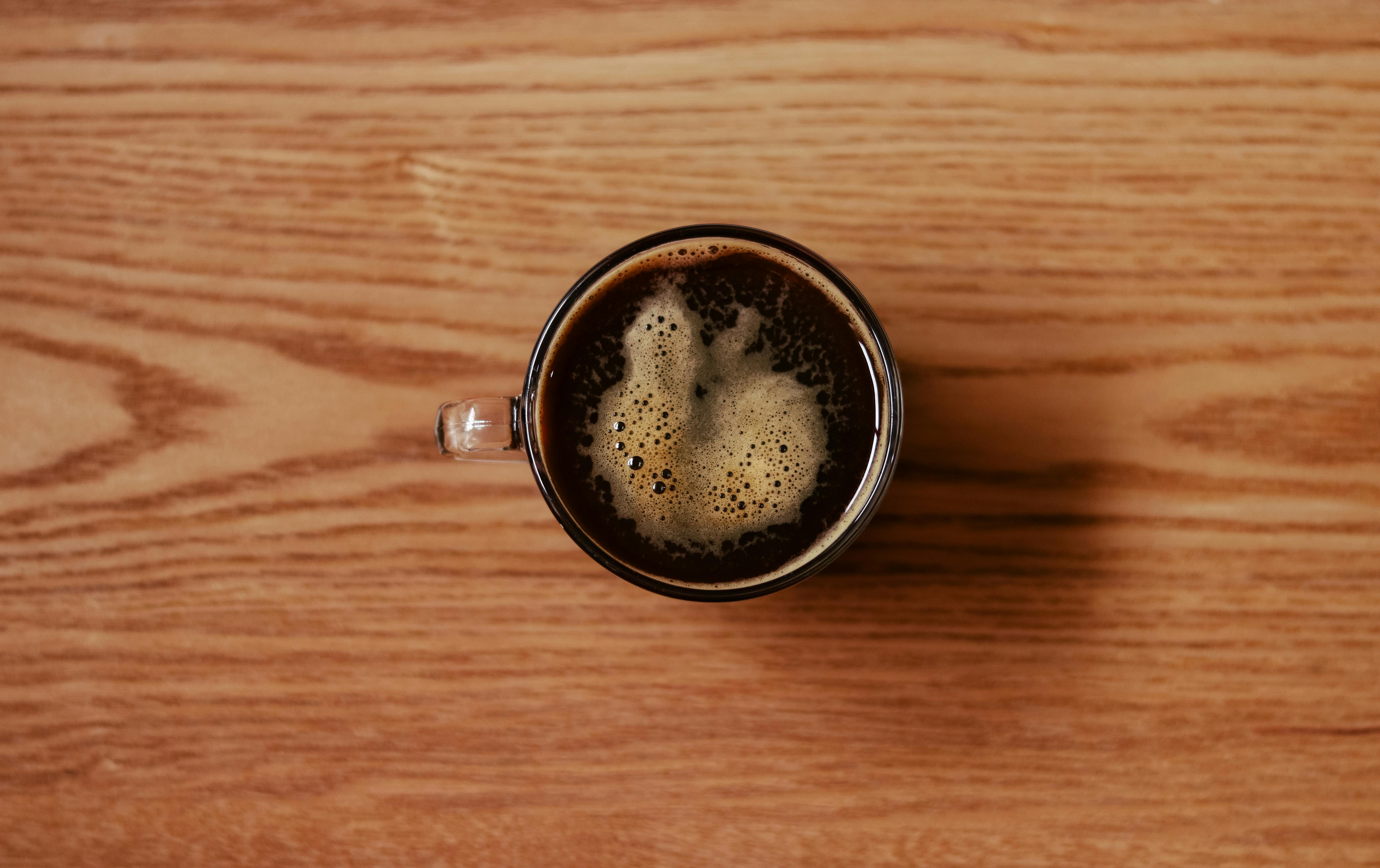Black Coffee in Mug on Wooden Table · Free Stock Photo
