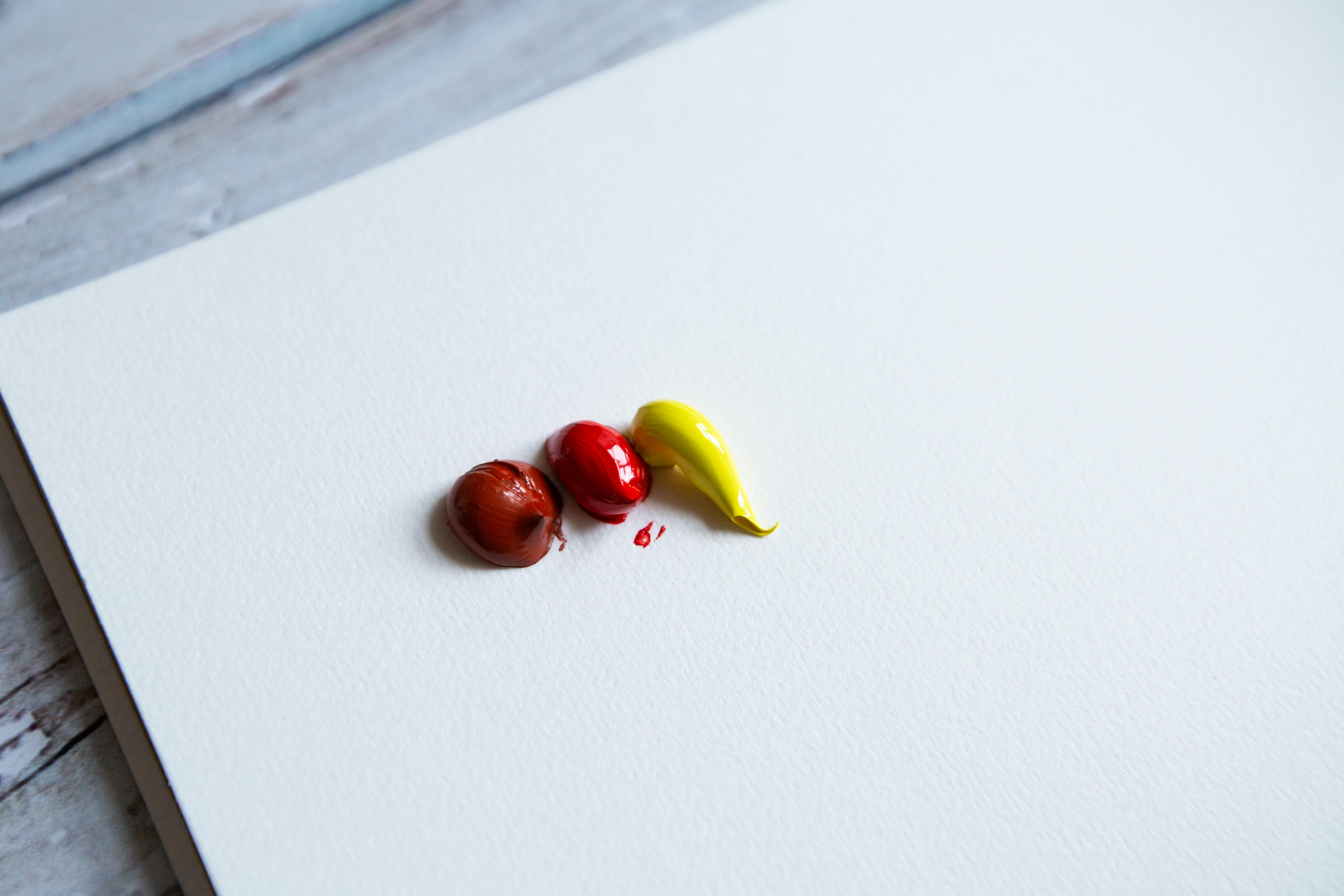 Paint blobs on white canvas · Free Stock Photo