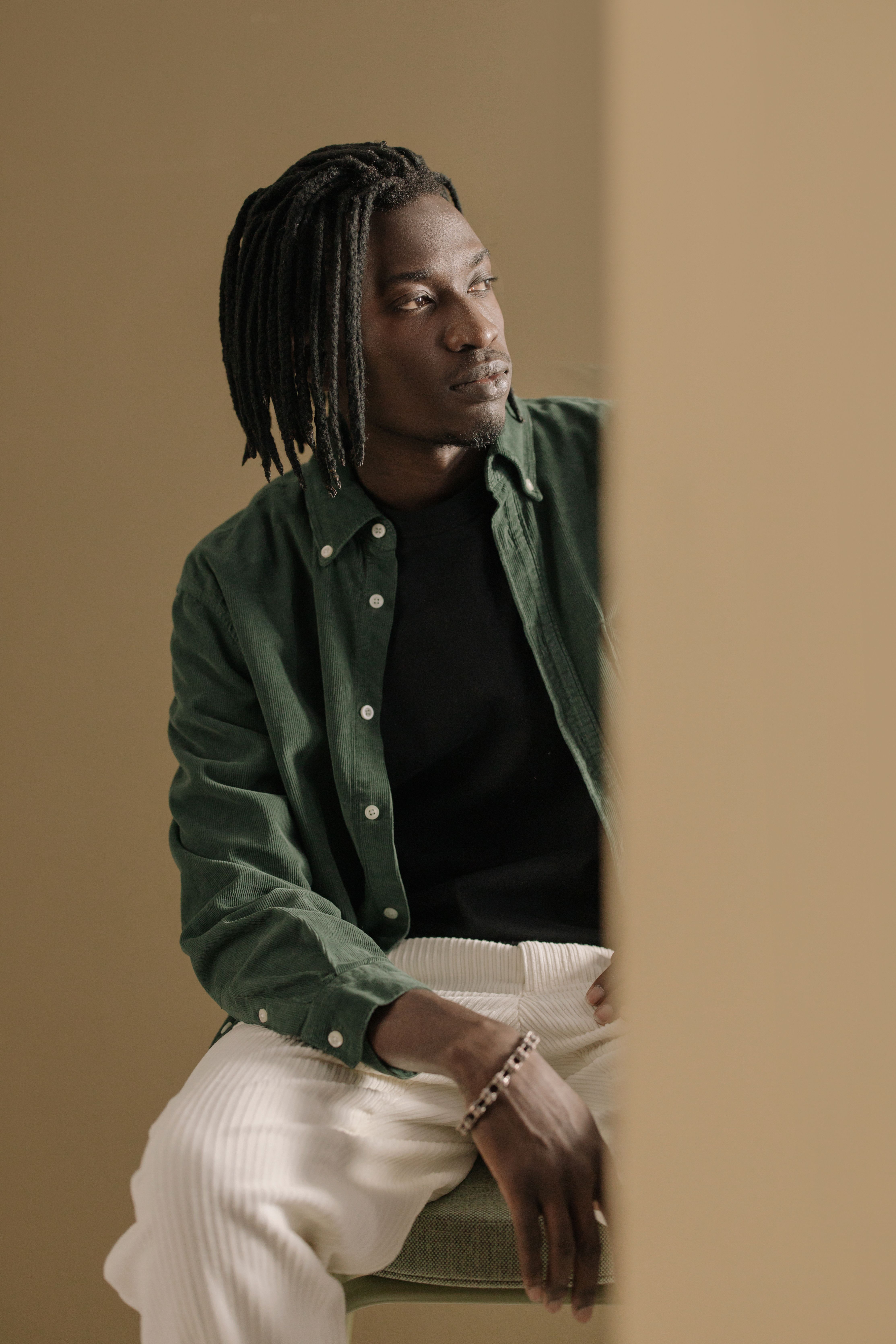 Black man with dreadlocks in white hoodie · Free Stock Photo