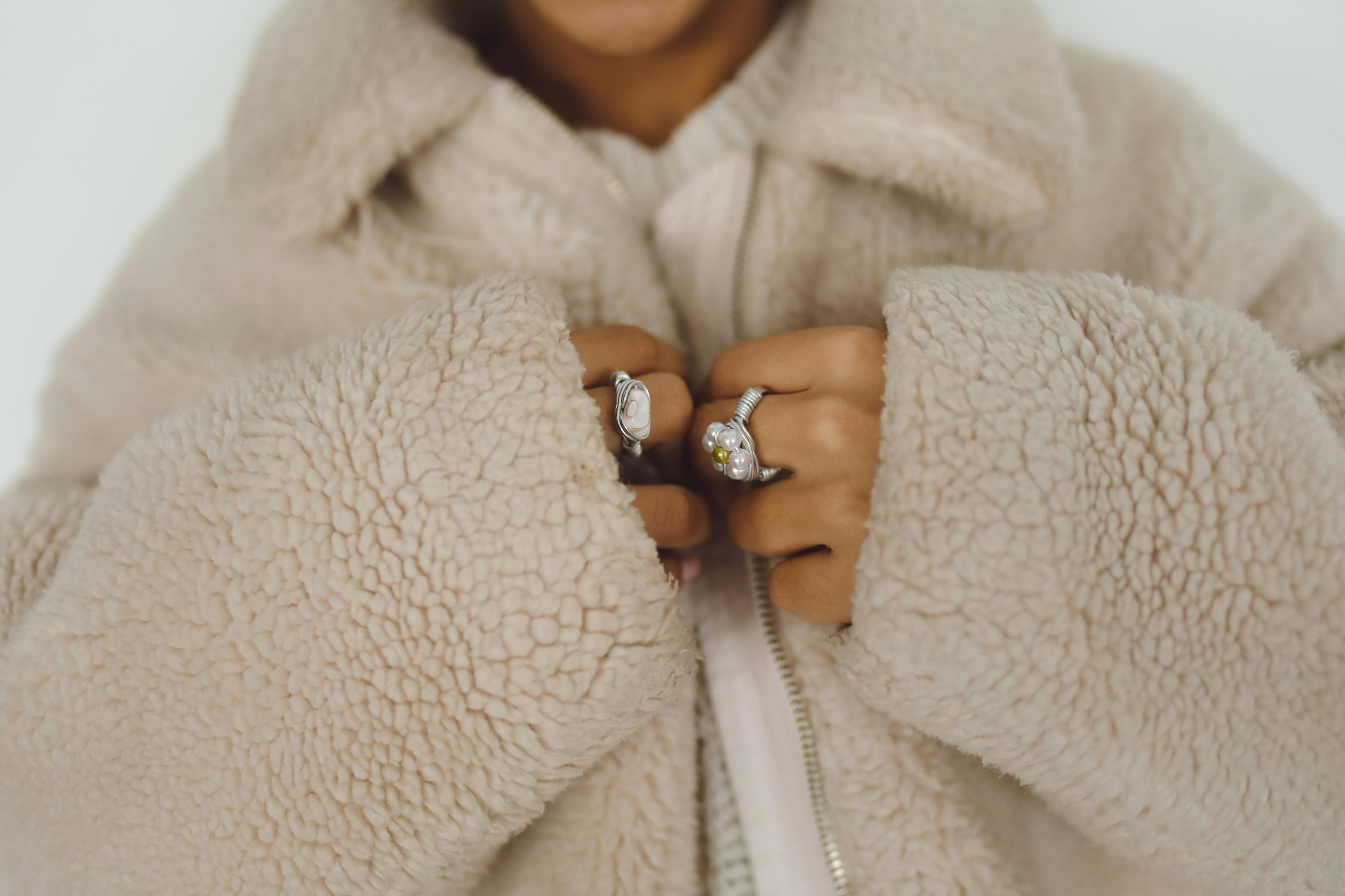 Woman in White Fur Coat Wearing Silver Ring · Free Stock Photo