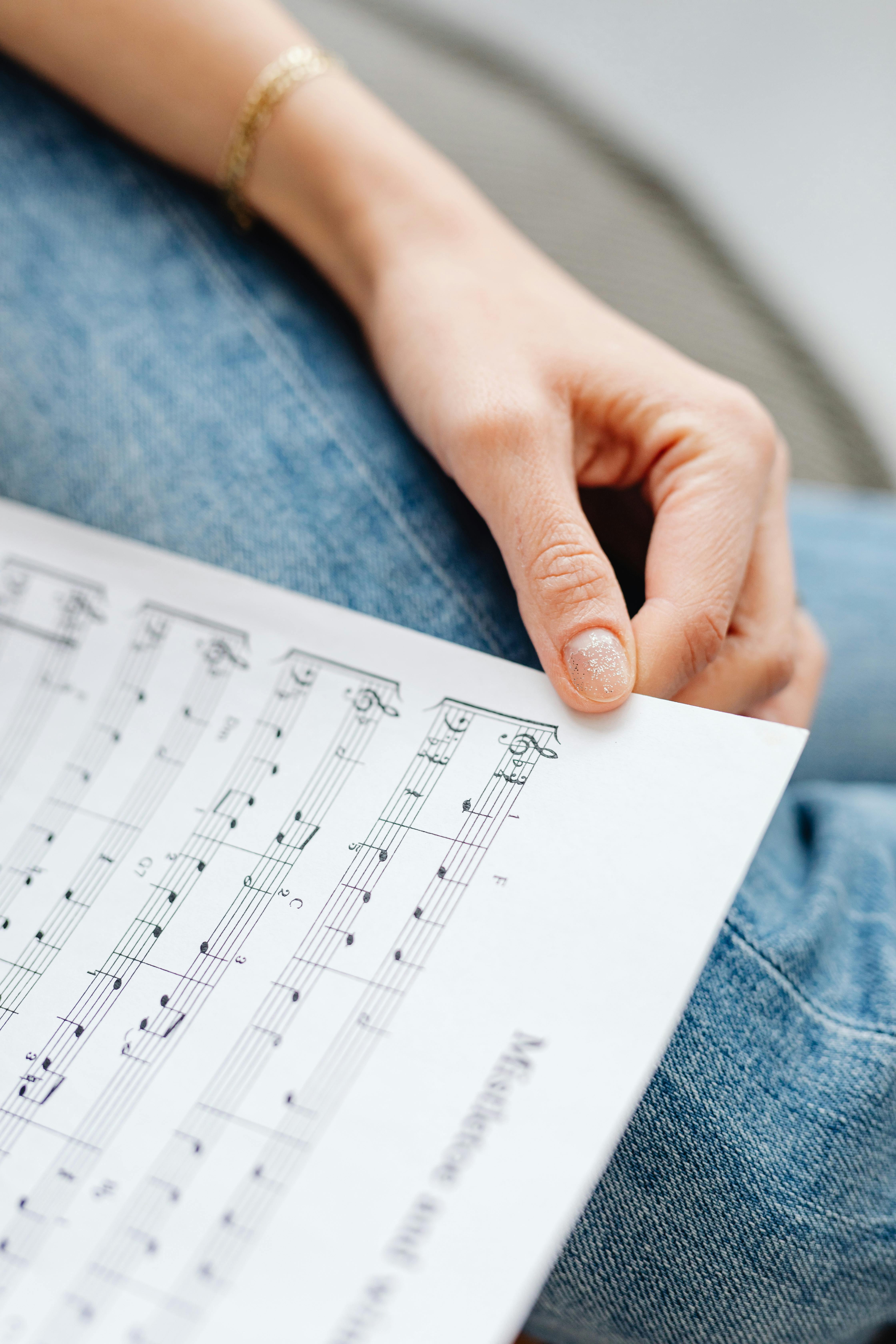 A Person holding Musical Notes · Free Stock Photo