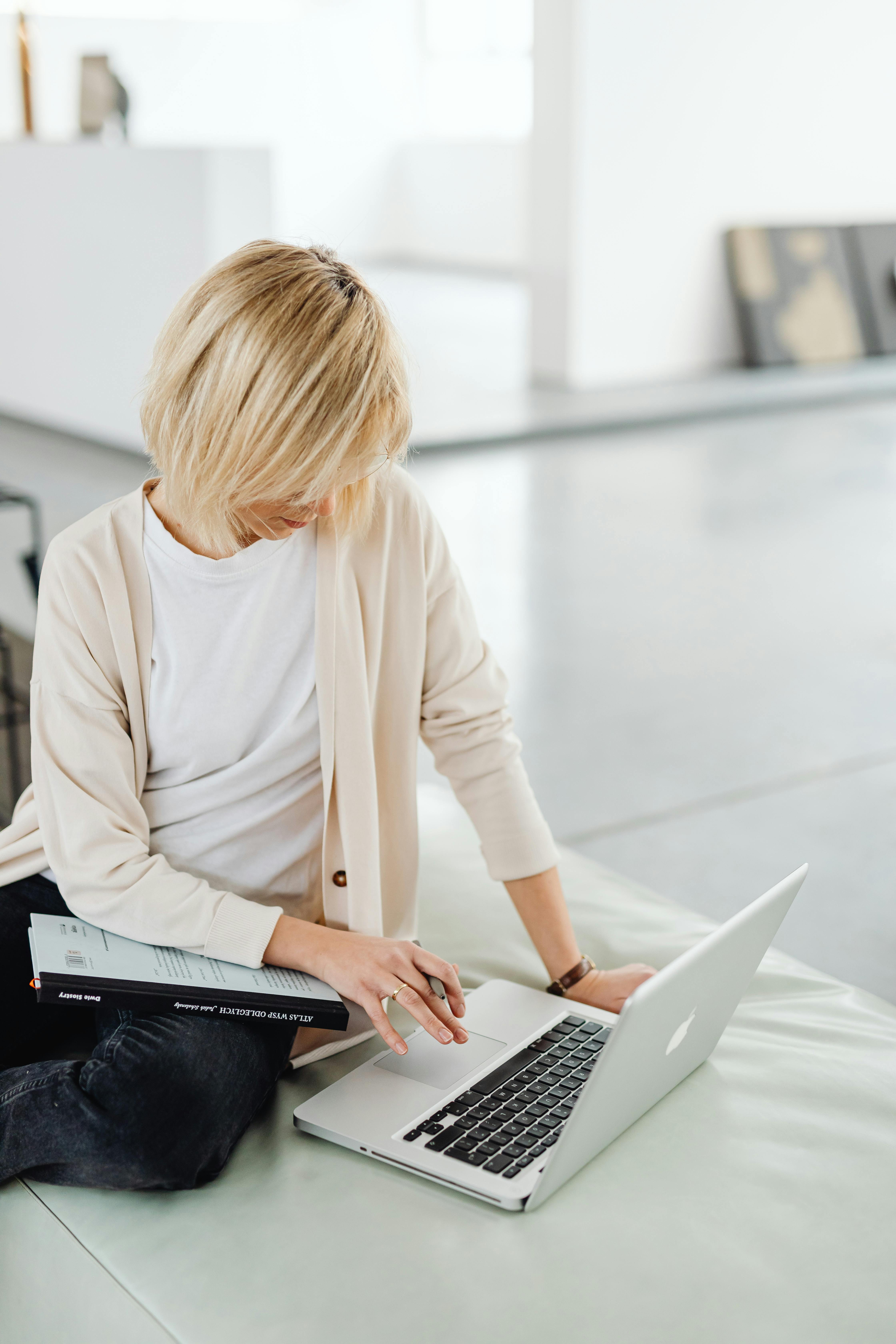 A Woman Using a MacBook Pro · Free Stock Photo