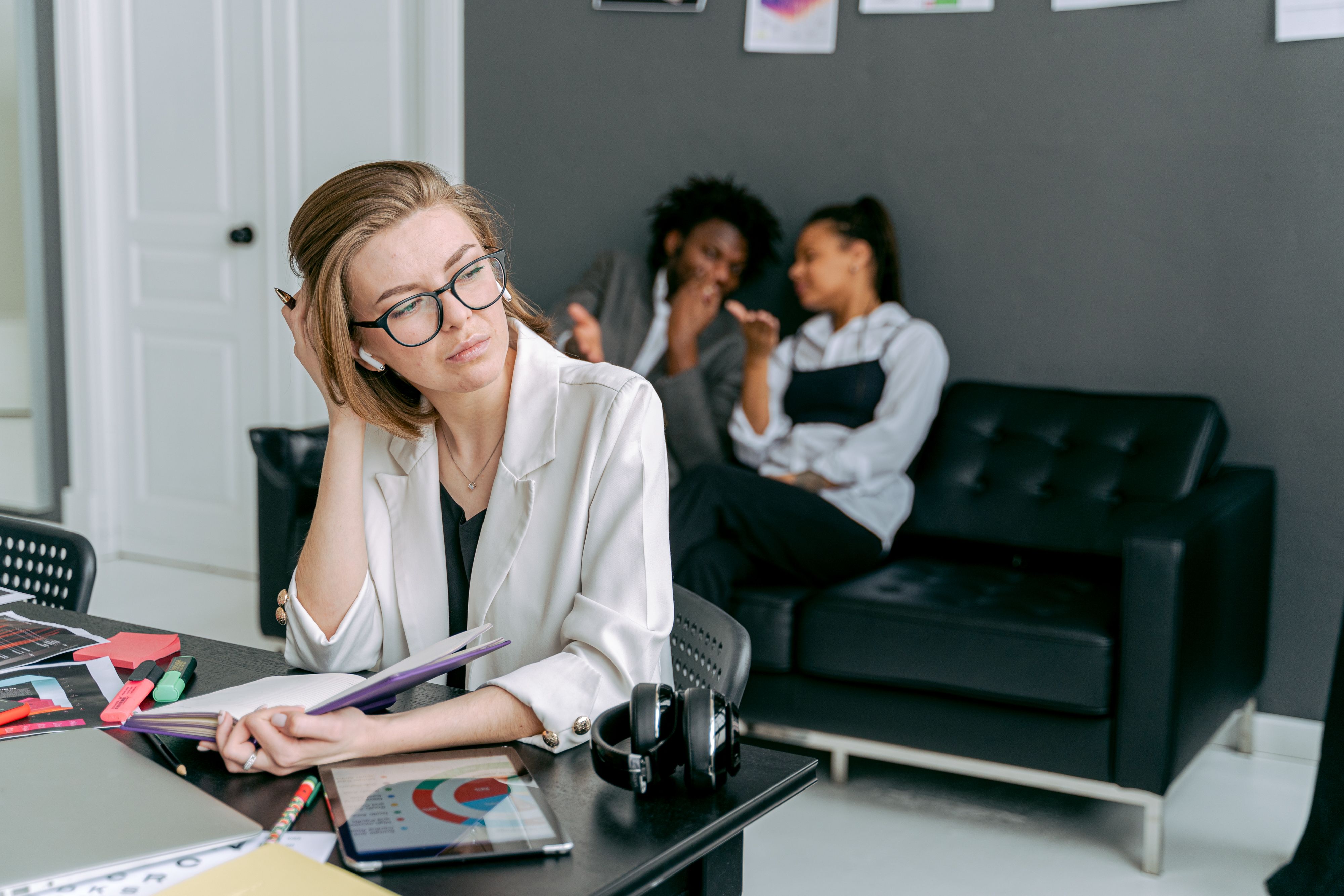 A Scared Woman Crouching while Her Hands are on Her Head · Free Stock Photo