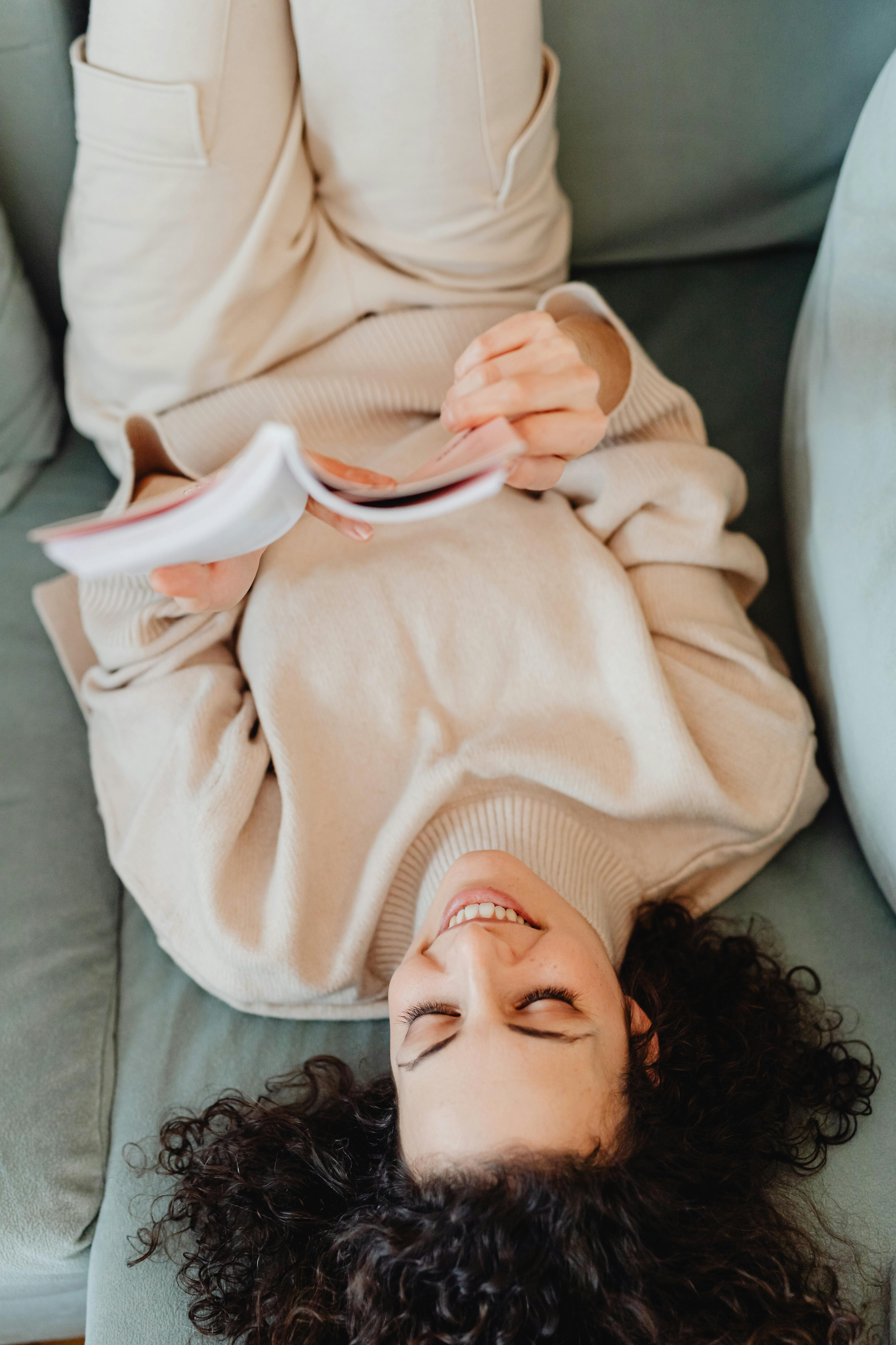 Woman Relaxing and Reading Book · Free Stock Photo