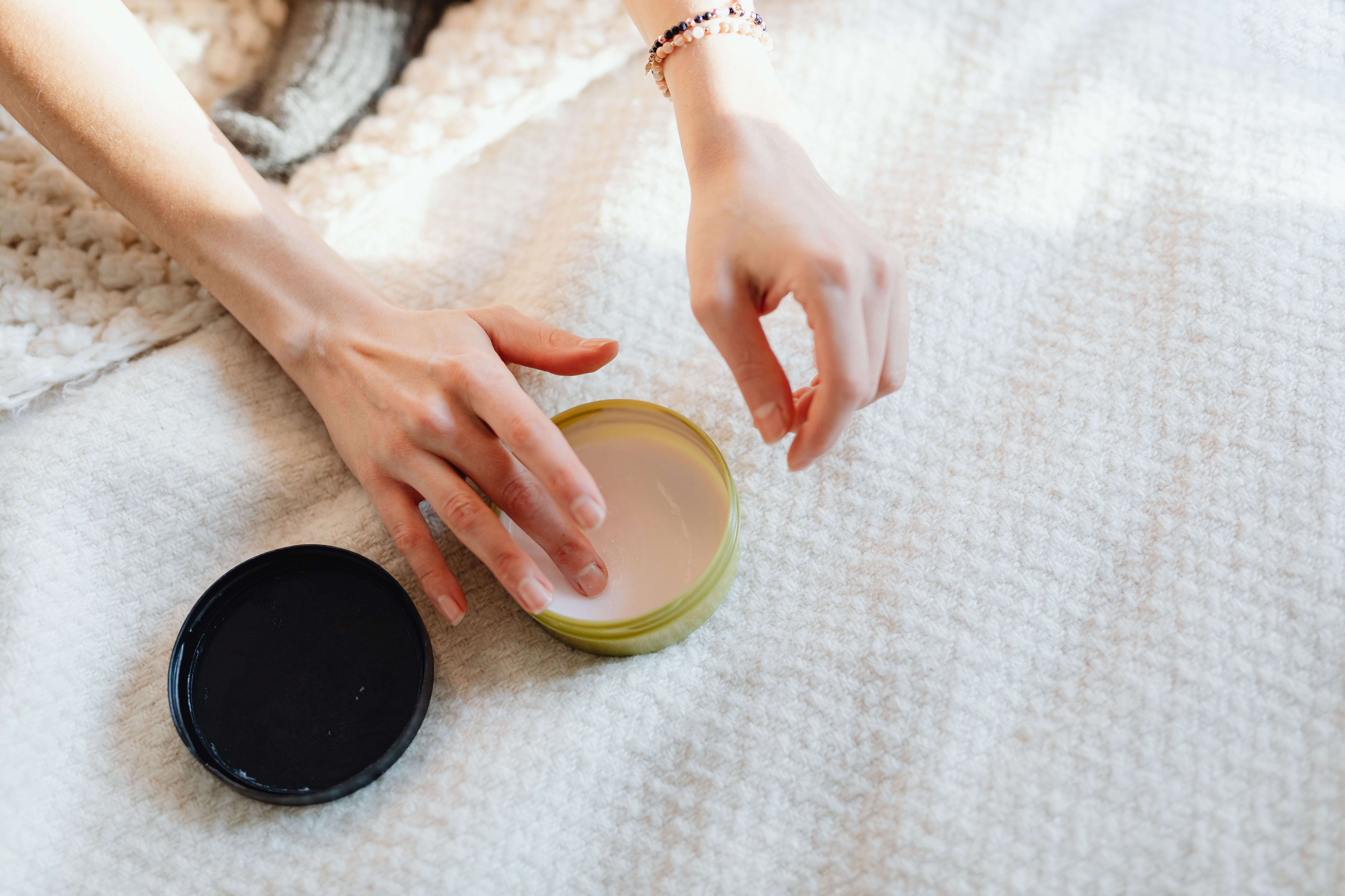 Close up of a Person Using a Cream · Free Stock Photo