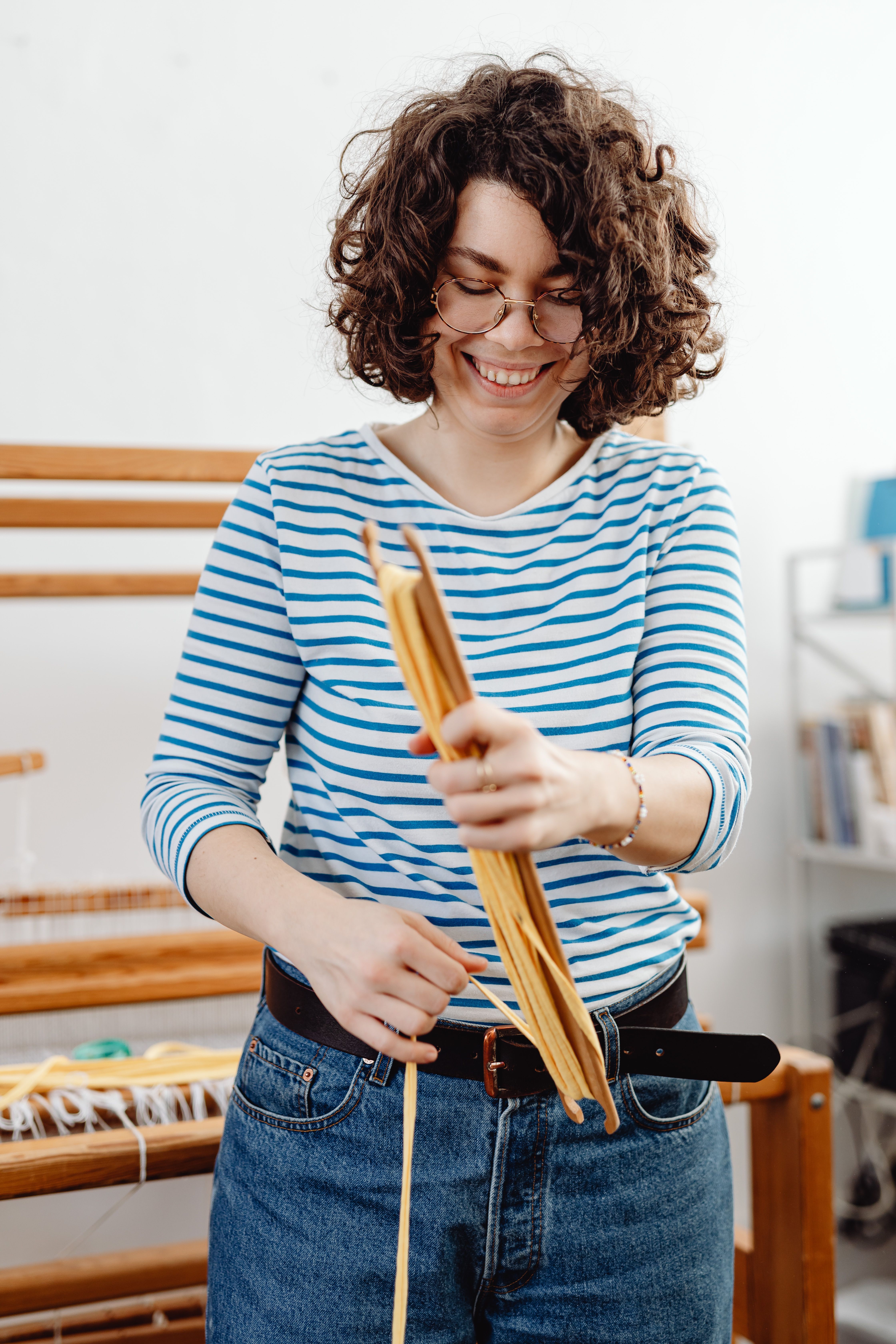 Woman Looping Weave on a Stick and Smiling · Free Stock Photo