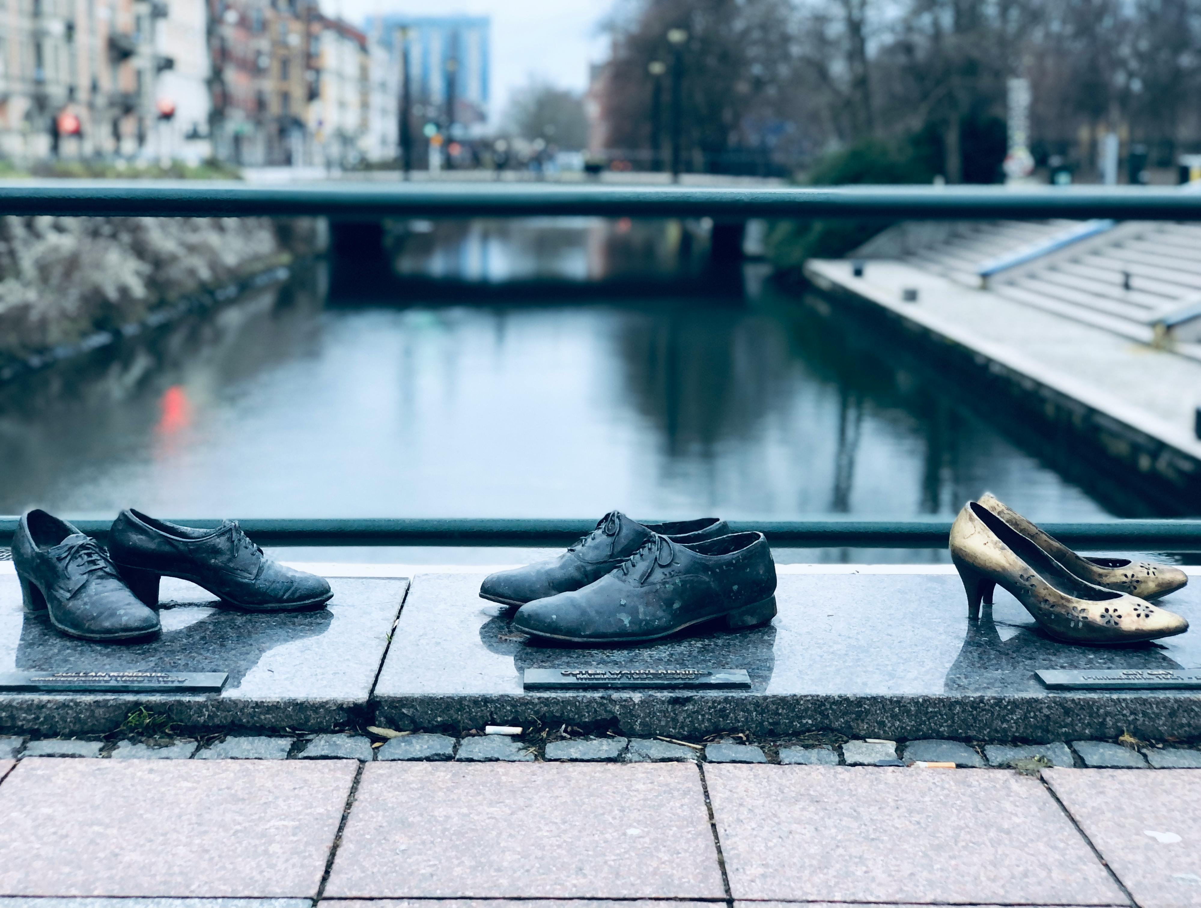 Shoes on Concrete Bridge · Free Stock Photo