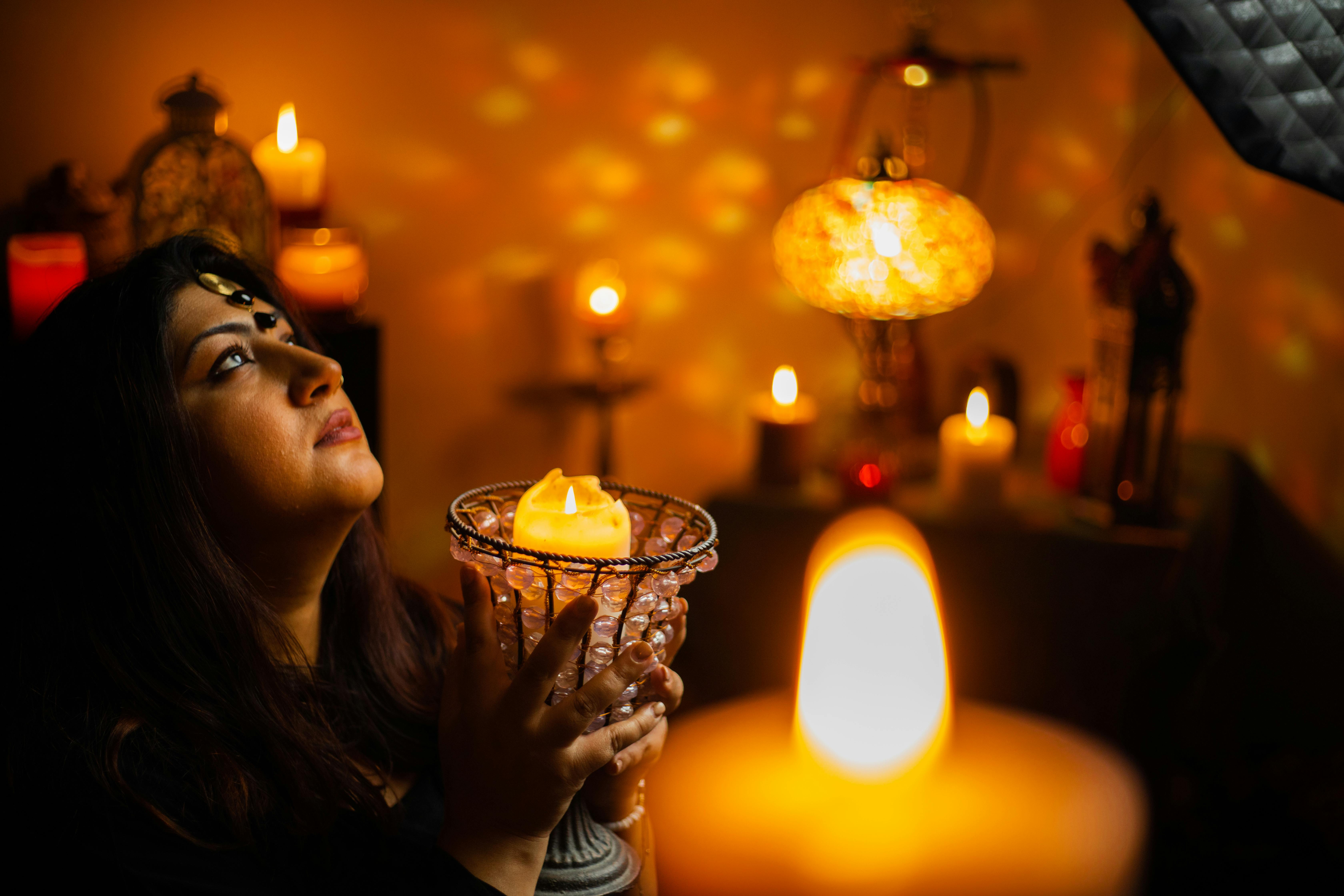 Top View of Female Hands Touching the Pavement next to Candles and ...