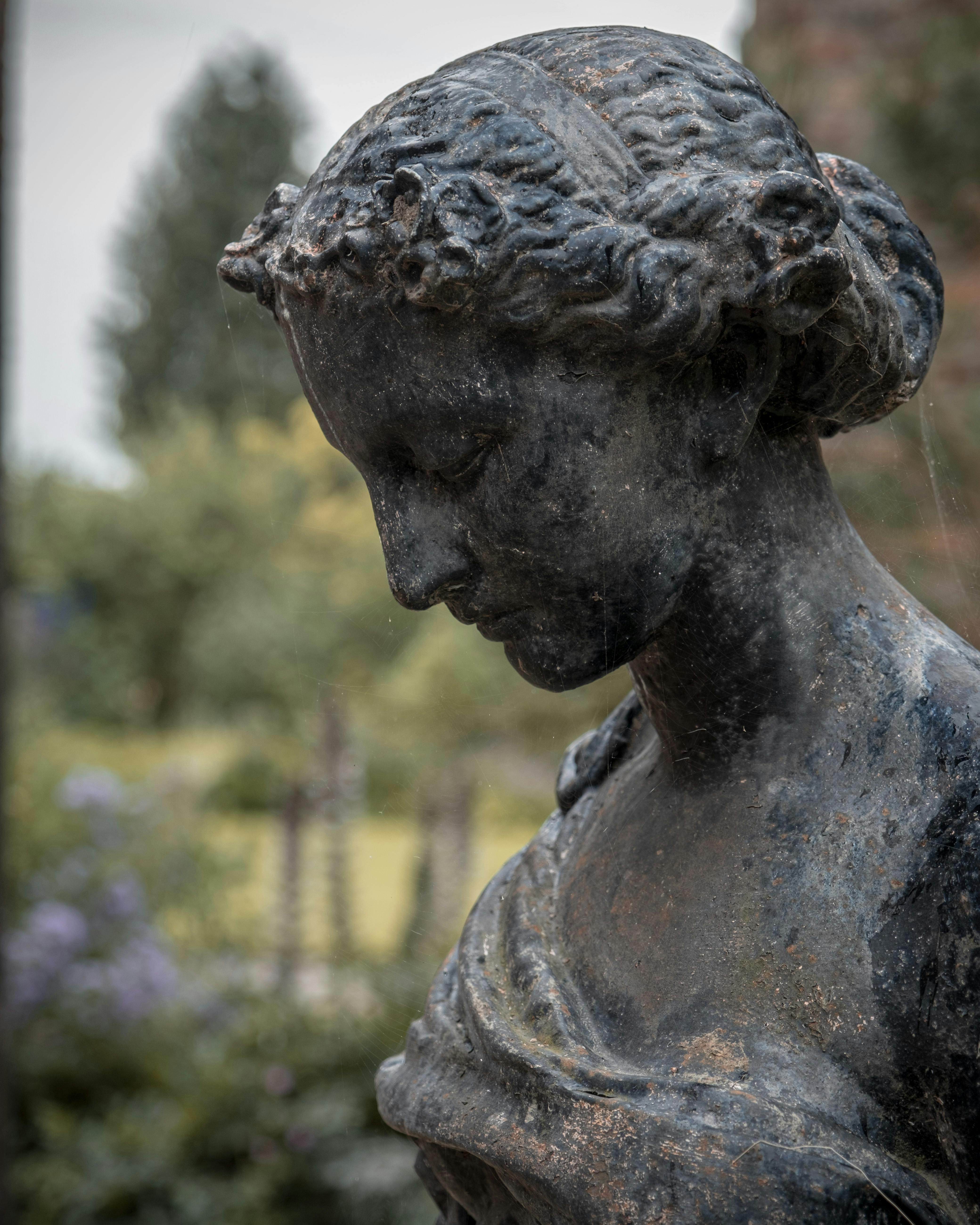 A Concrete Statue of a Man · Free Stock Photo