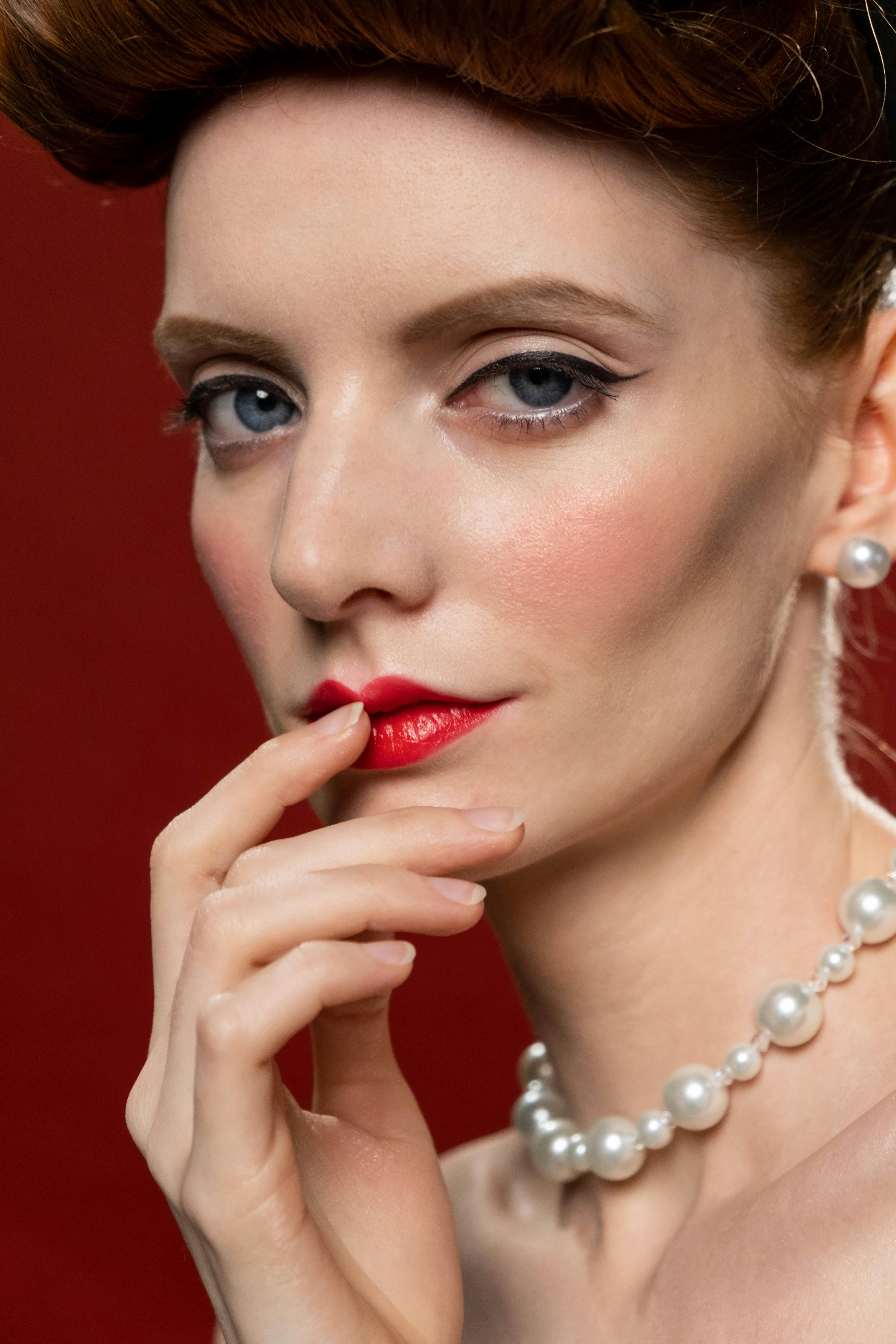 Woman With Pearl Beads and Flower Cutouts on Her Face · Free Stock Photo