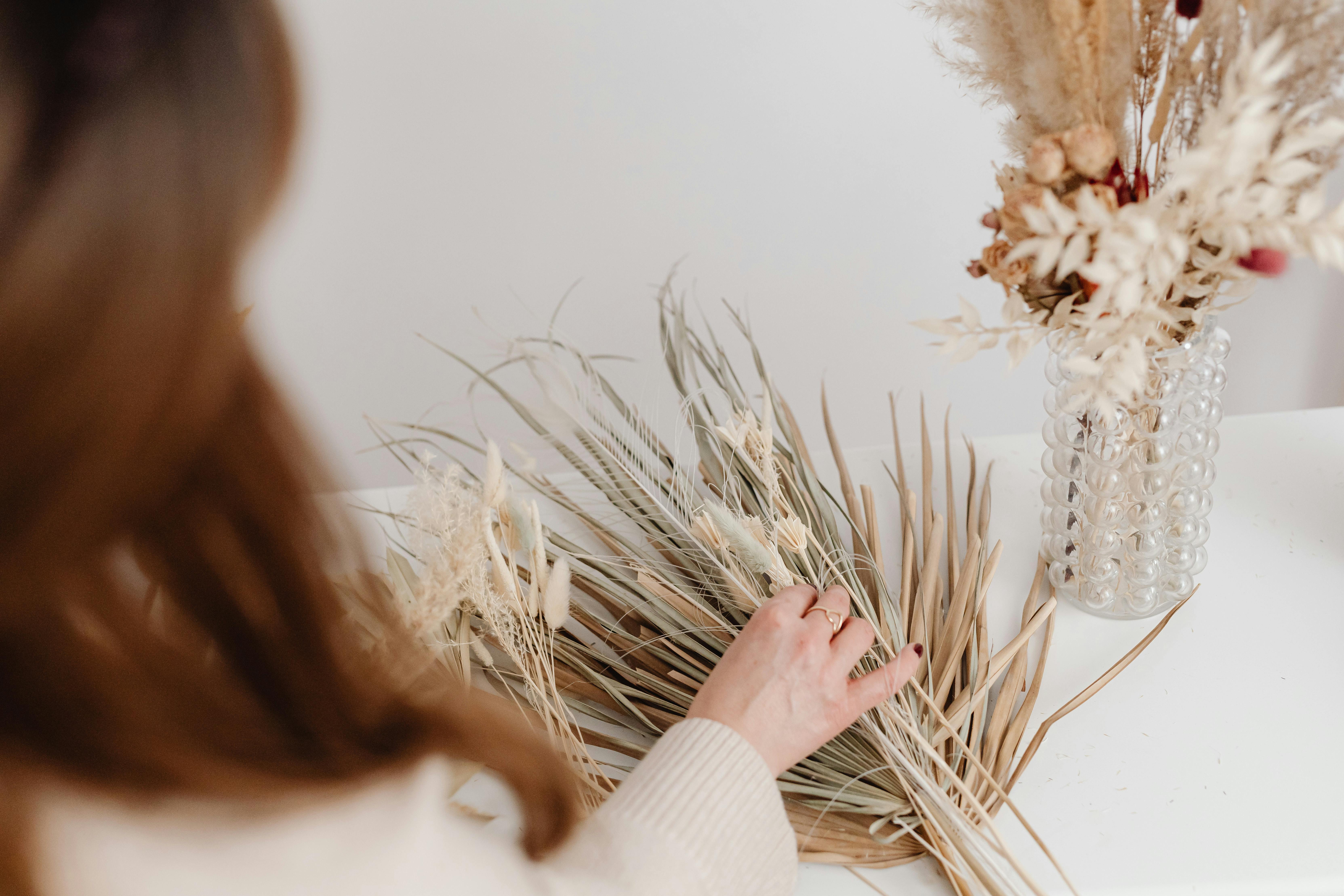 Person Arranging Flower Vase · Free Stock Photo