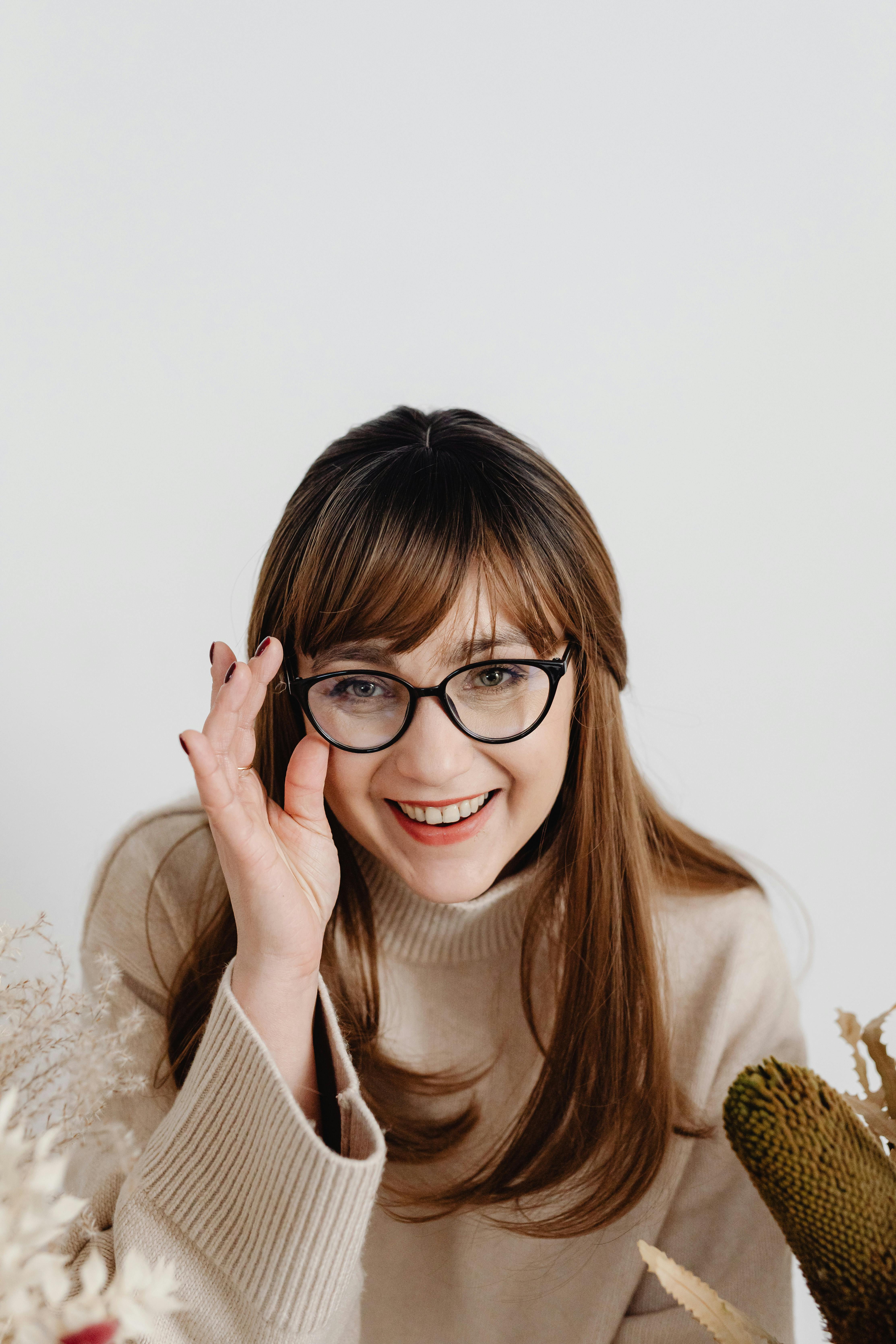 Woman in Eyeglasses With Black Frames Posing for Photo · Free Stock Photo