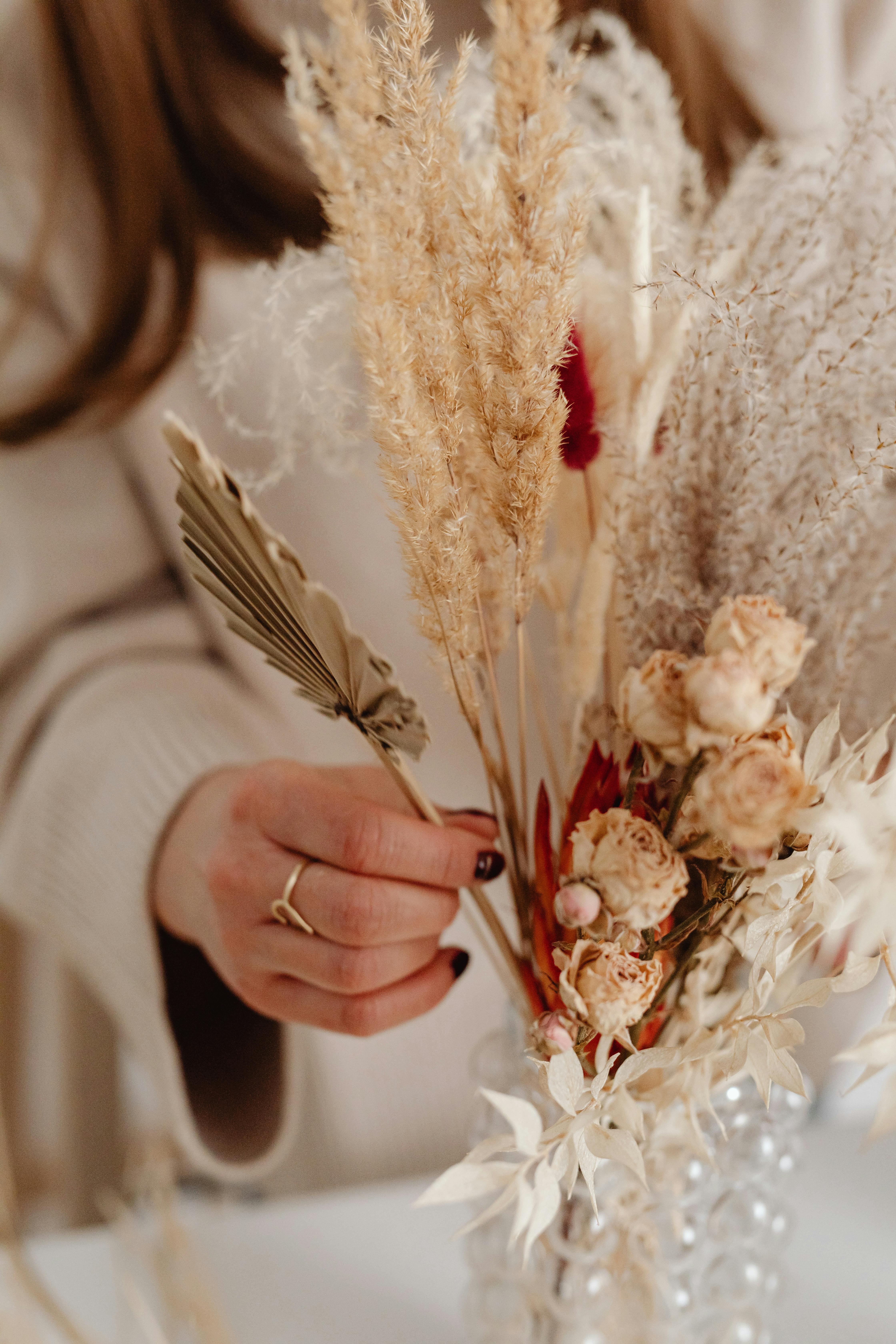 Female Hand with Flowers · Free Stock Photo
