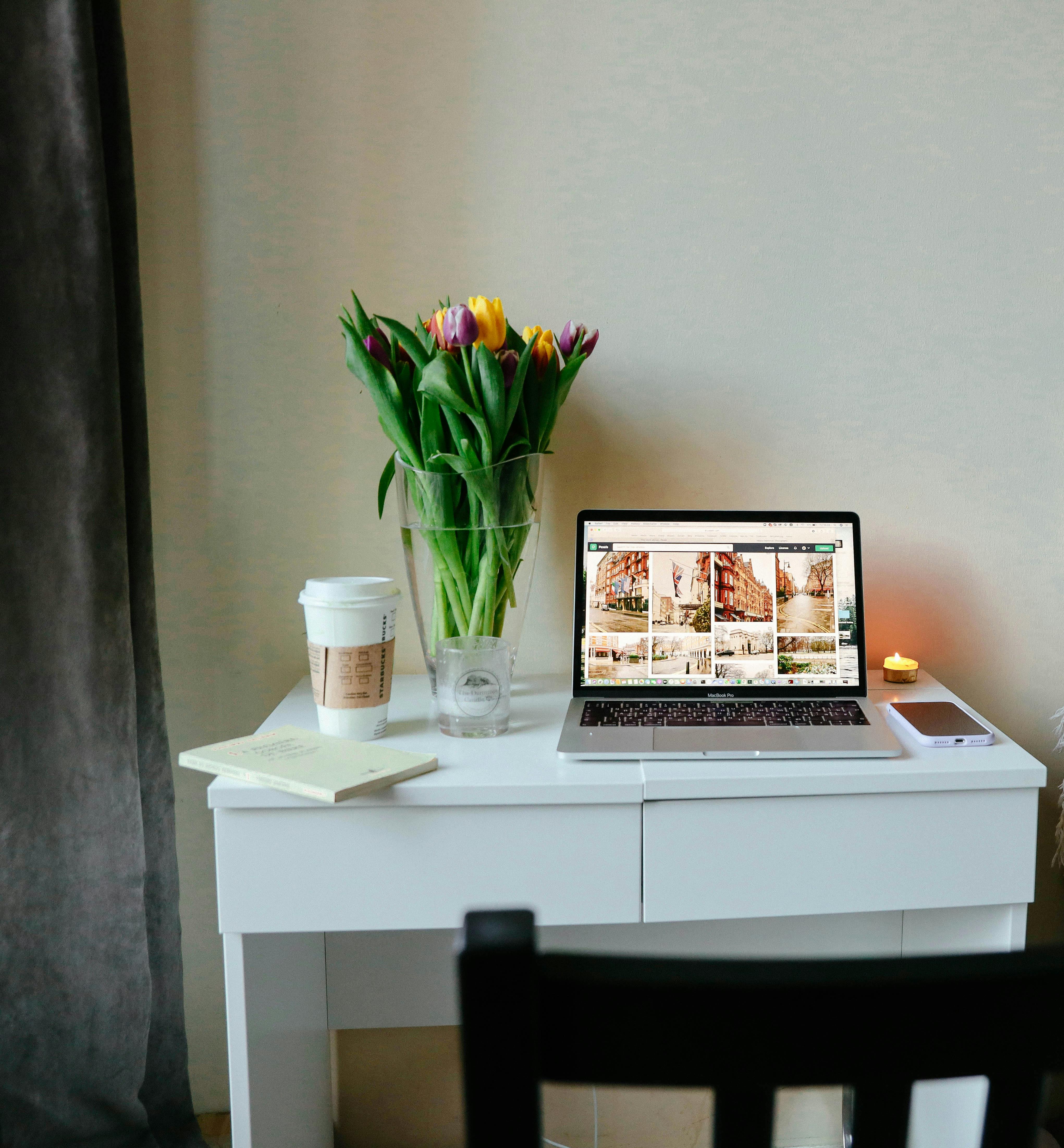 A Laptop on White Wooden Table · Free Stock Photo