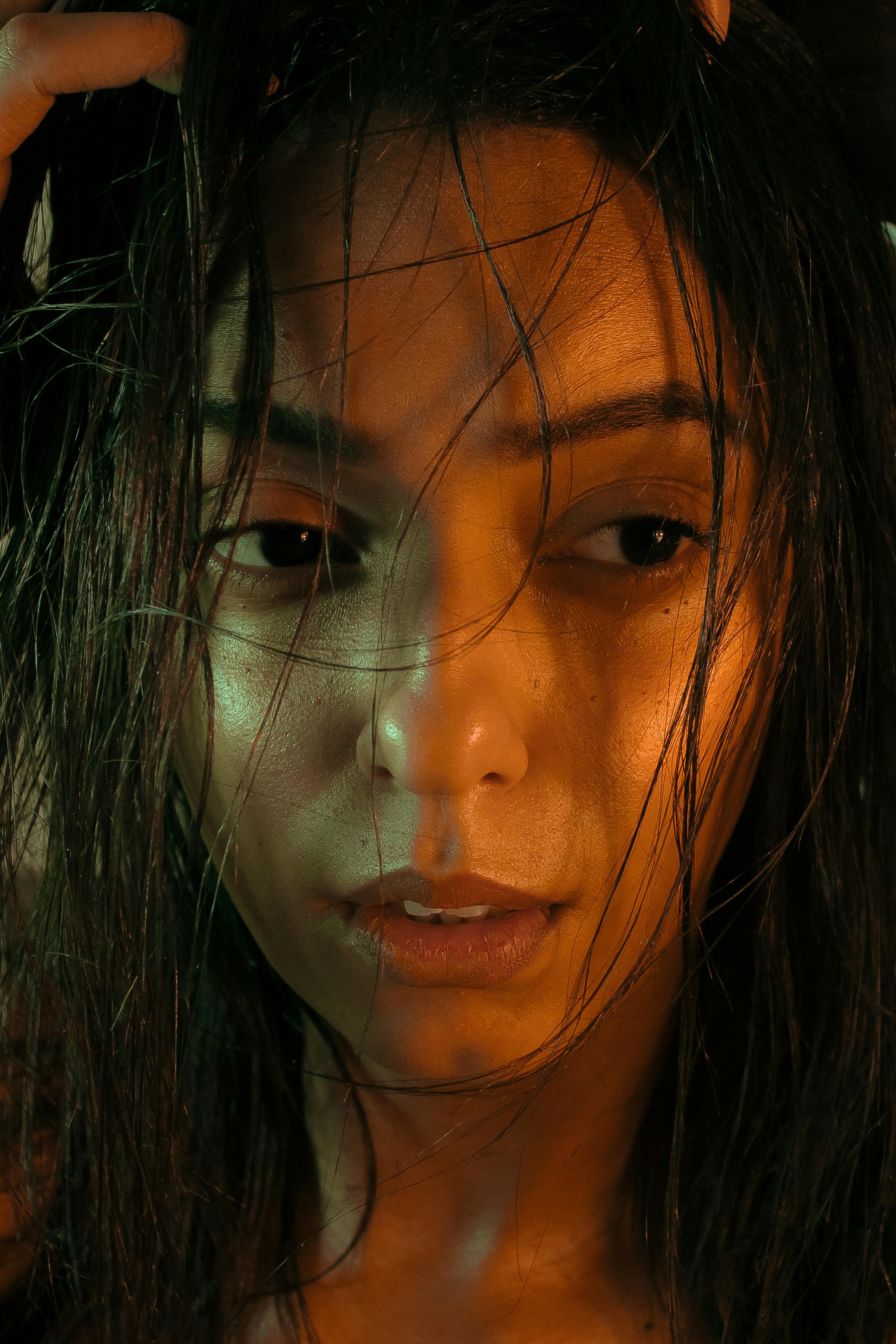 Woman with glowing light on dace and lighter · Free Stock Photo