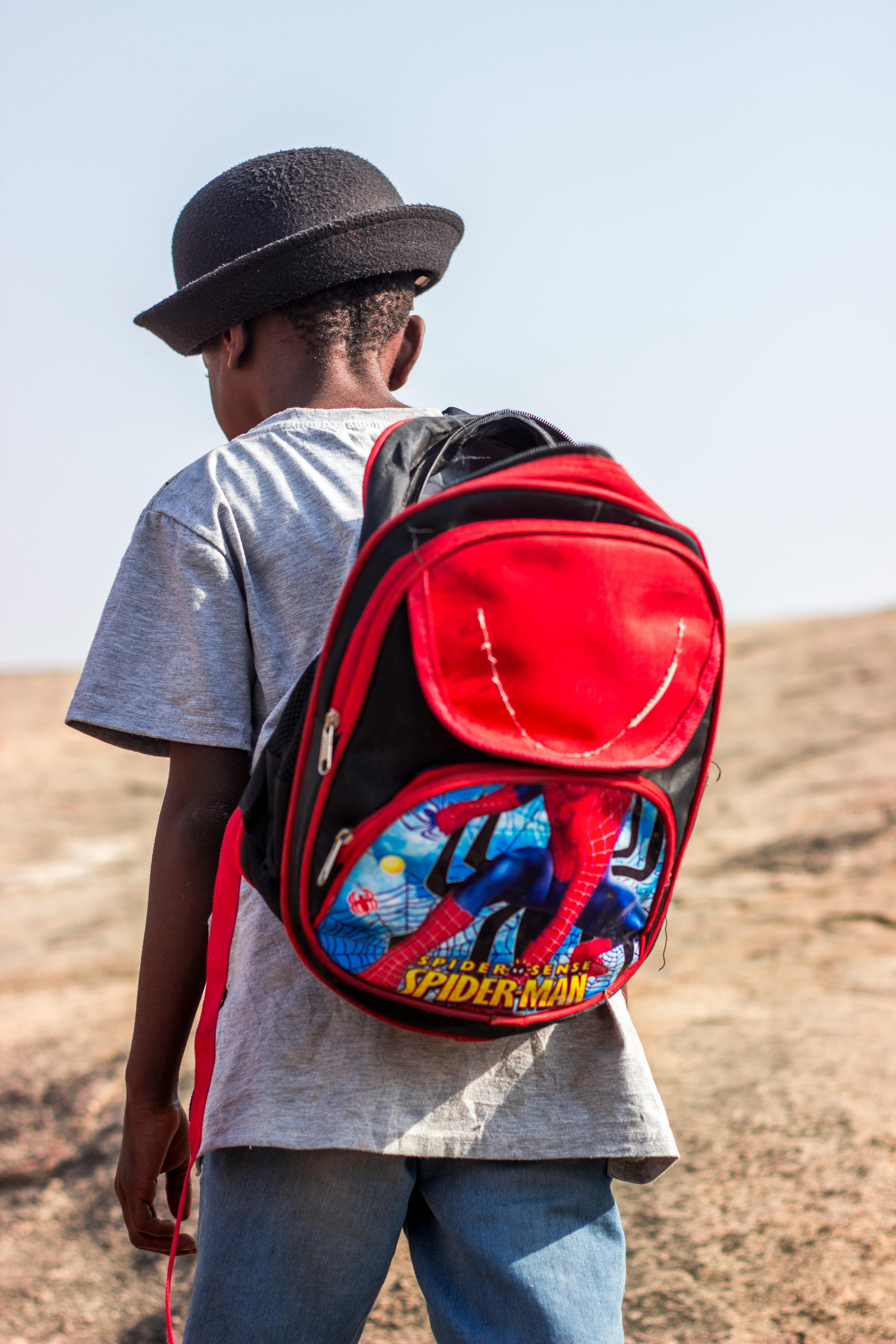 A Boy Carrying a Backpack · Free Stock Photo