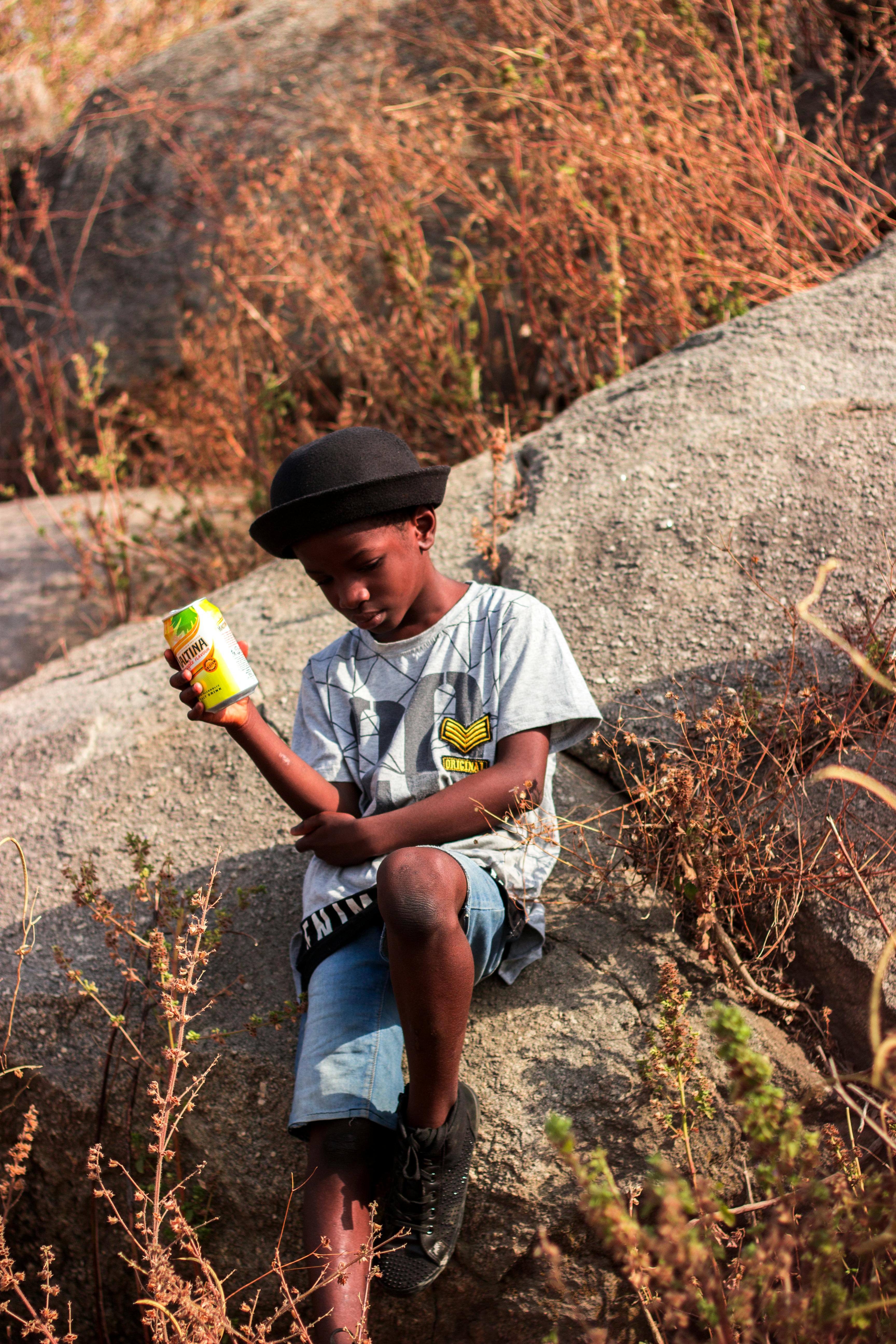 A Boy Walking on the Rock Formation · Free Stock Photo