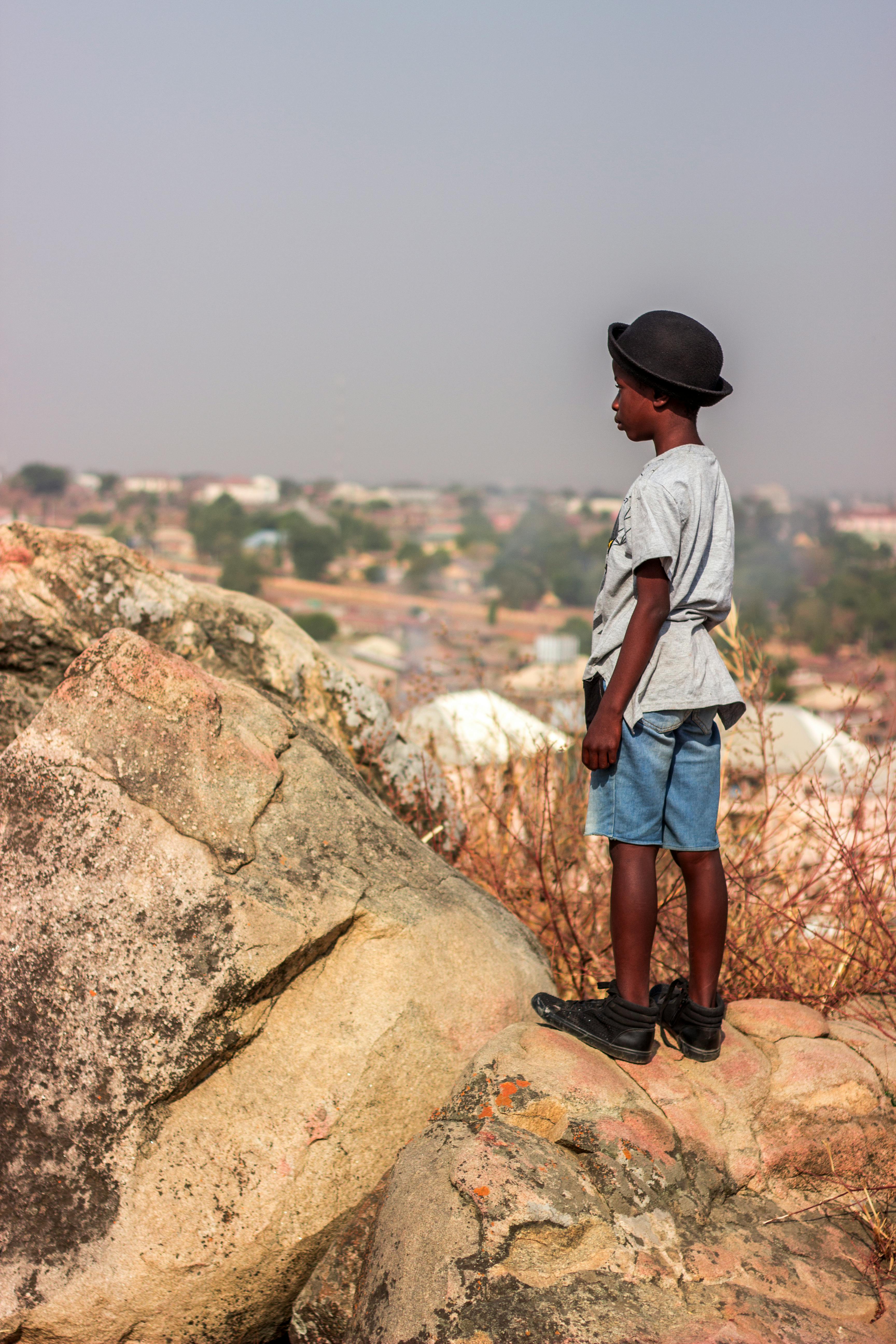 Boys Diving from Rock Formation · Free Stock Photo