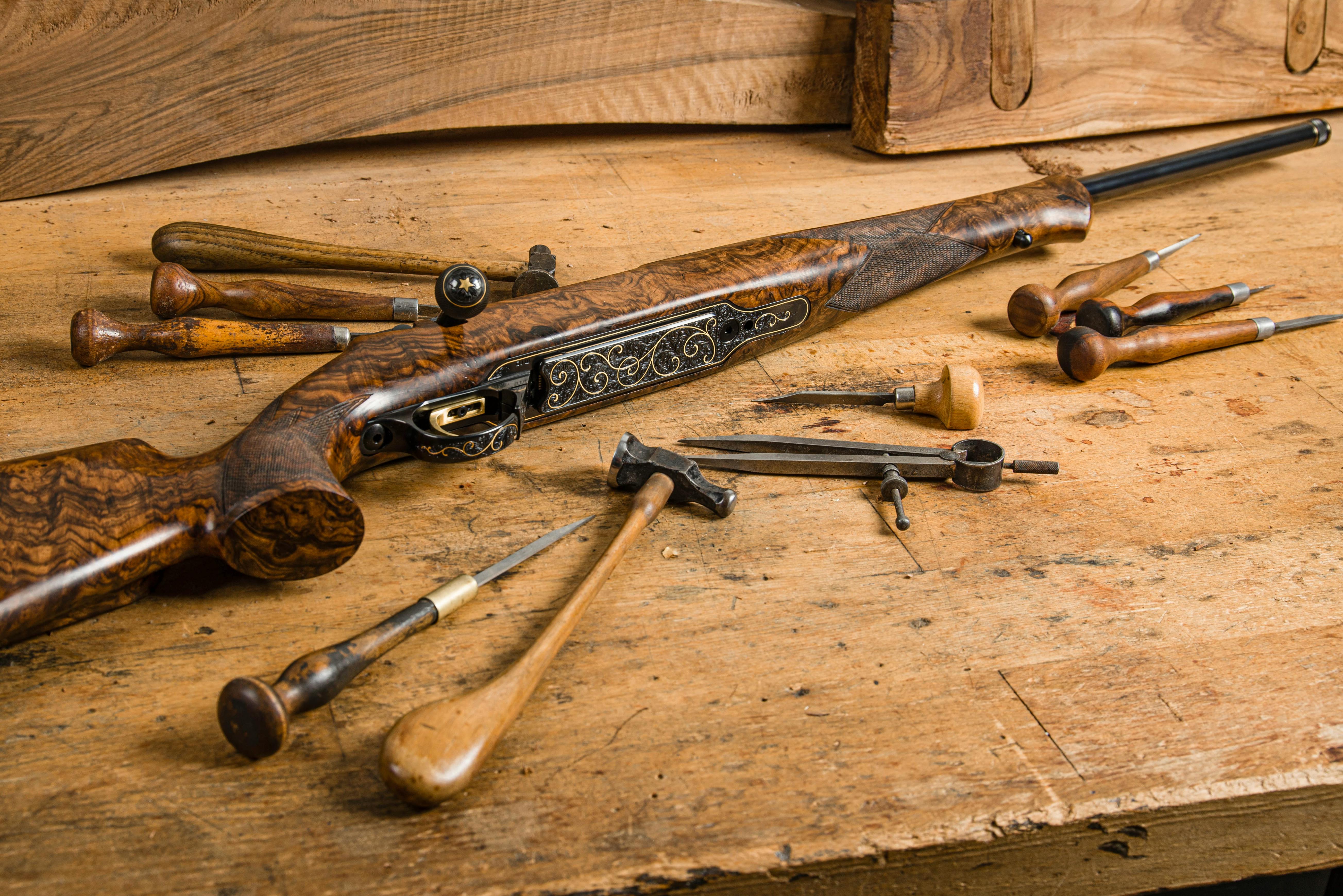 Antique Rifle on Wooden Table · Free Stock Photo