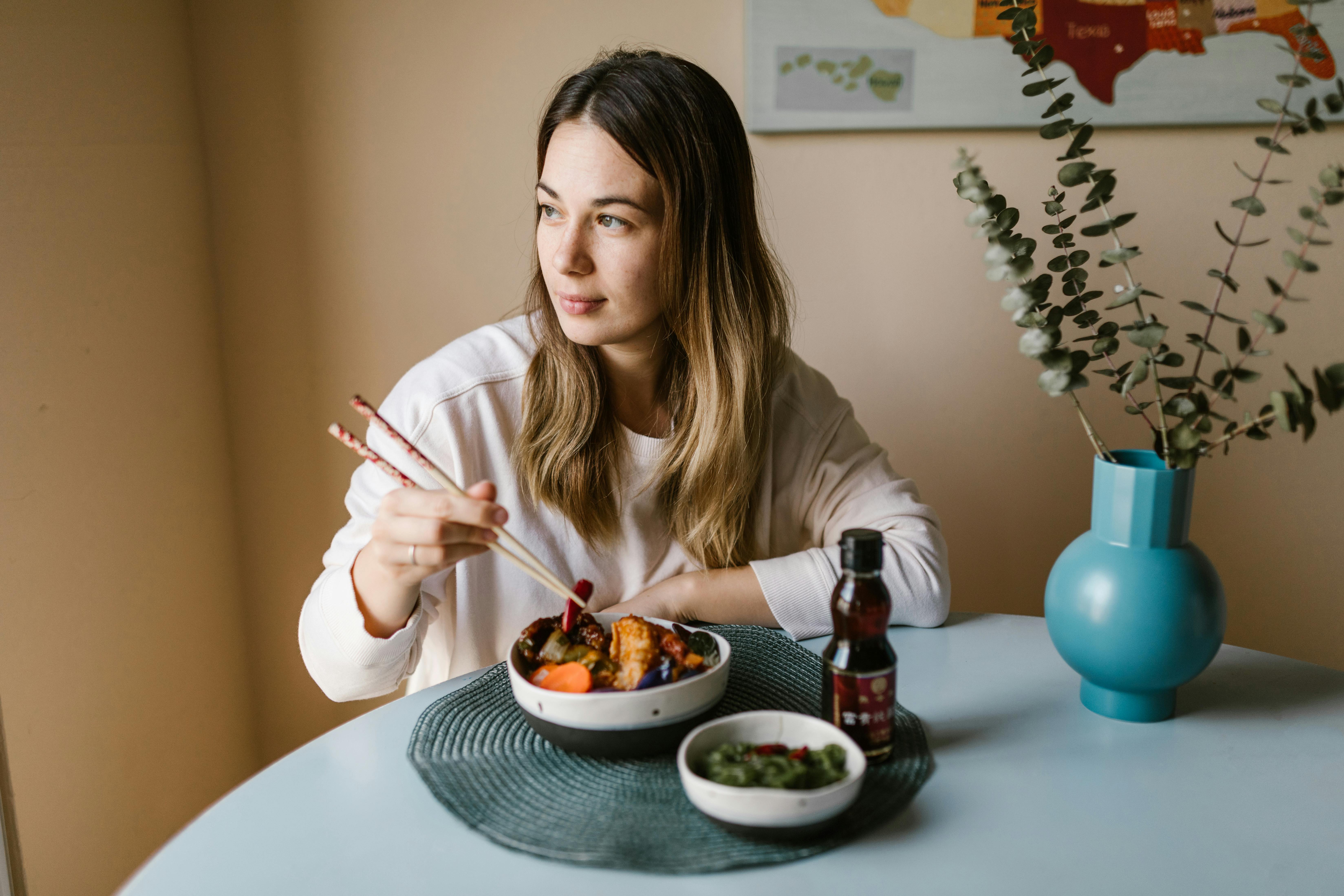 A Woman Sitting at the Table · Free Stock Photo