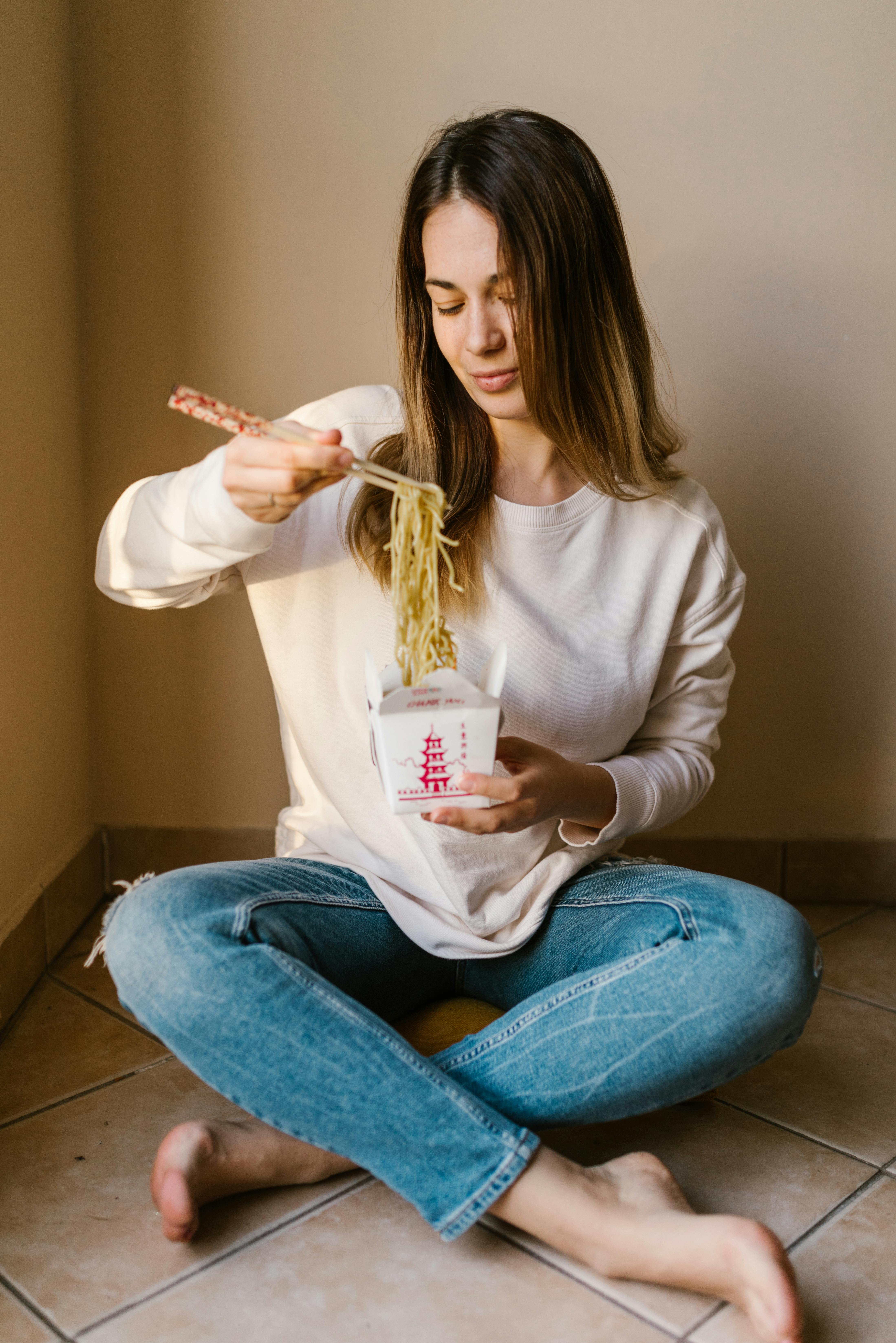 A Woman Eating at the Table · Free Stock Photo