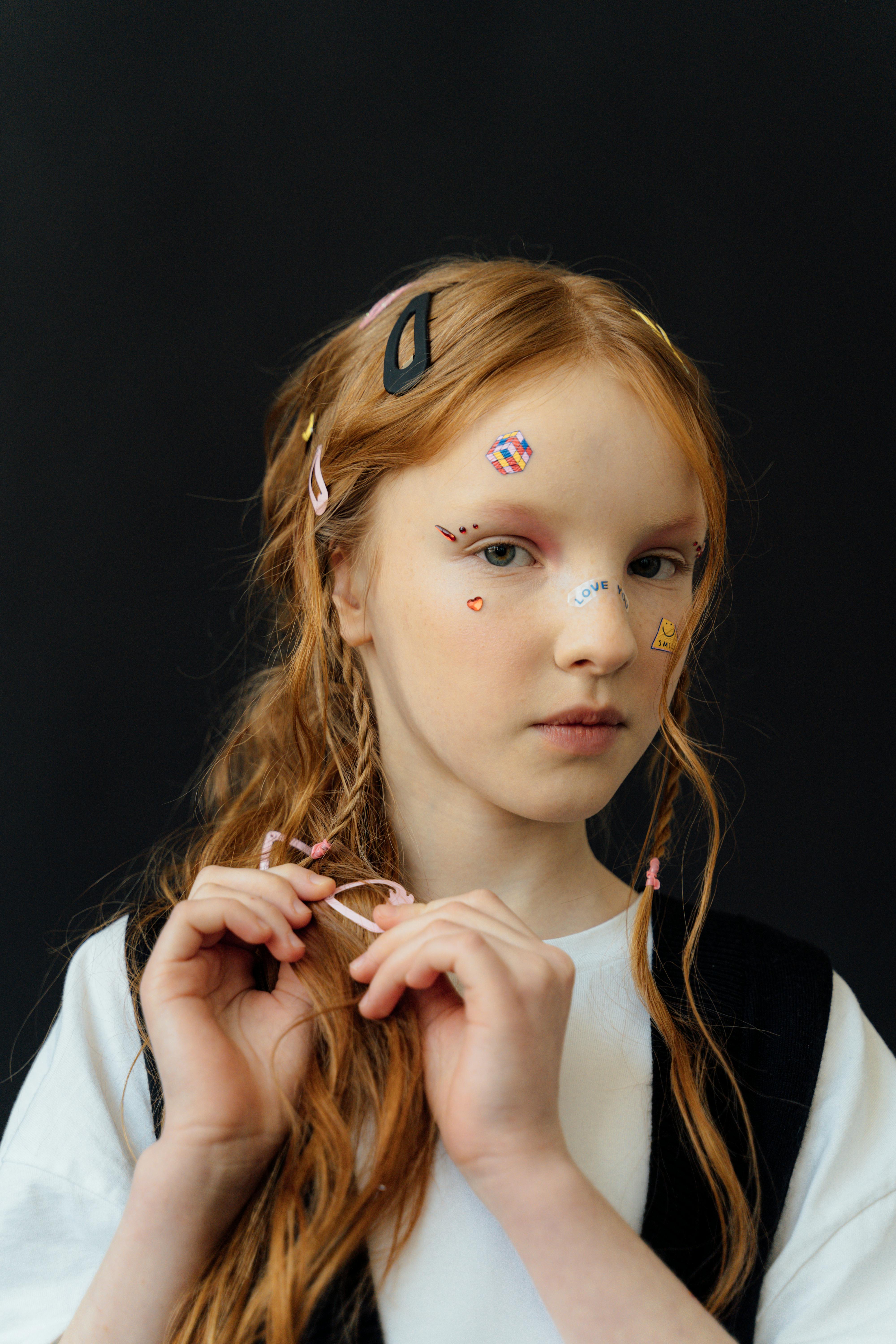 Girl with Stickers on Her Face · Free Stock Photo