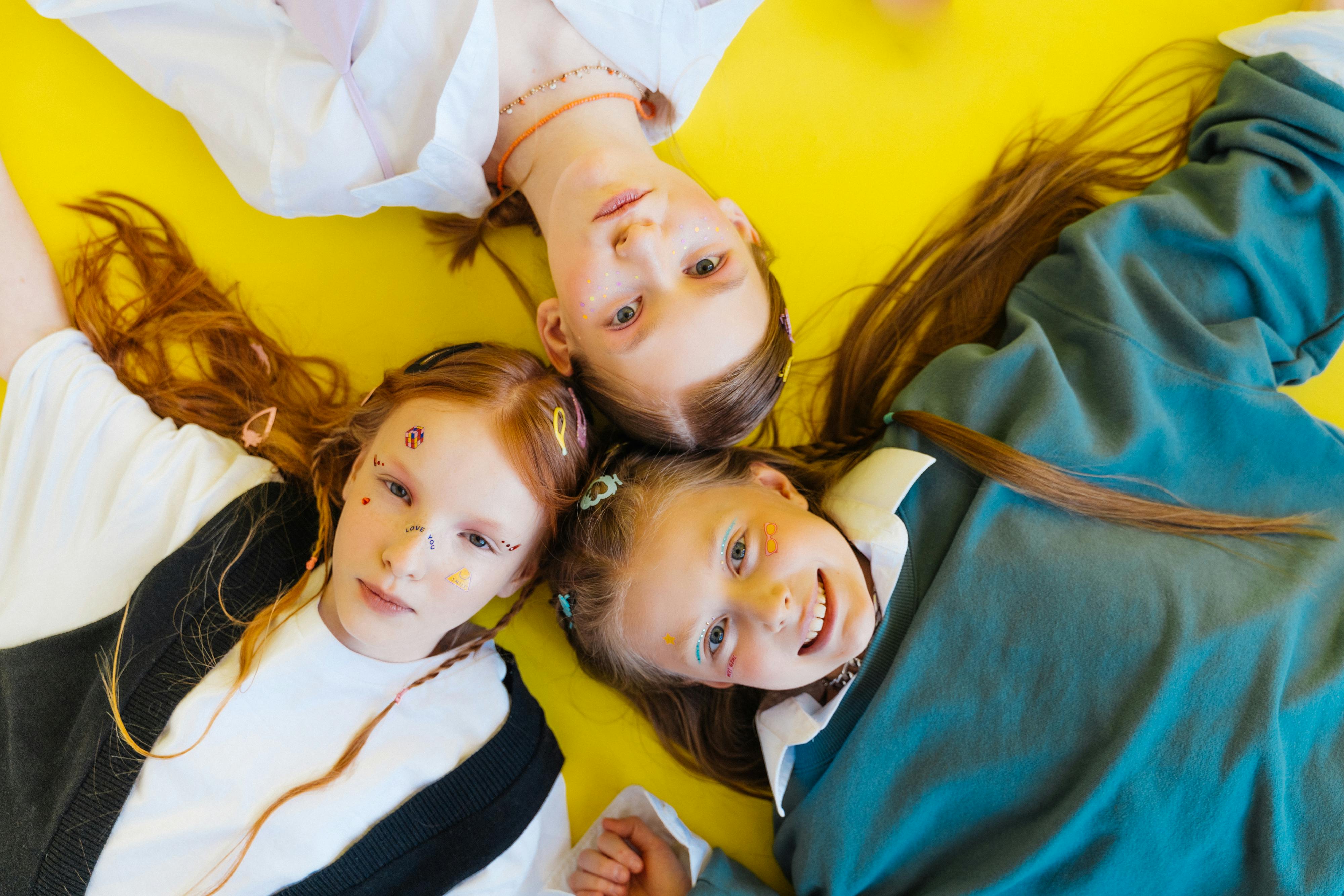 Girls Lying Beside Each Other · Free Stock Photo