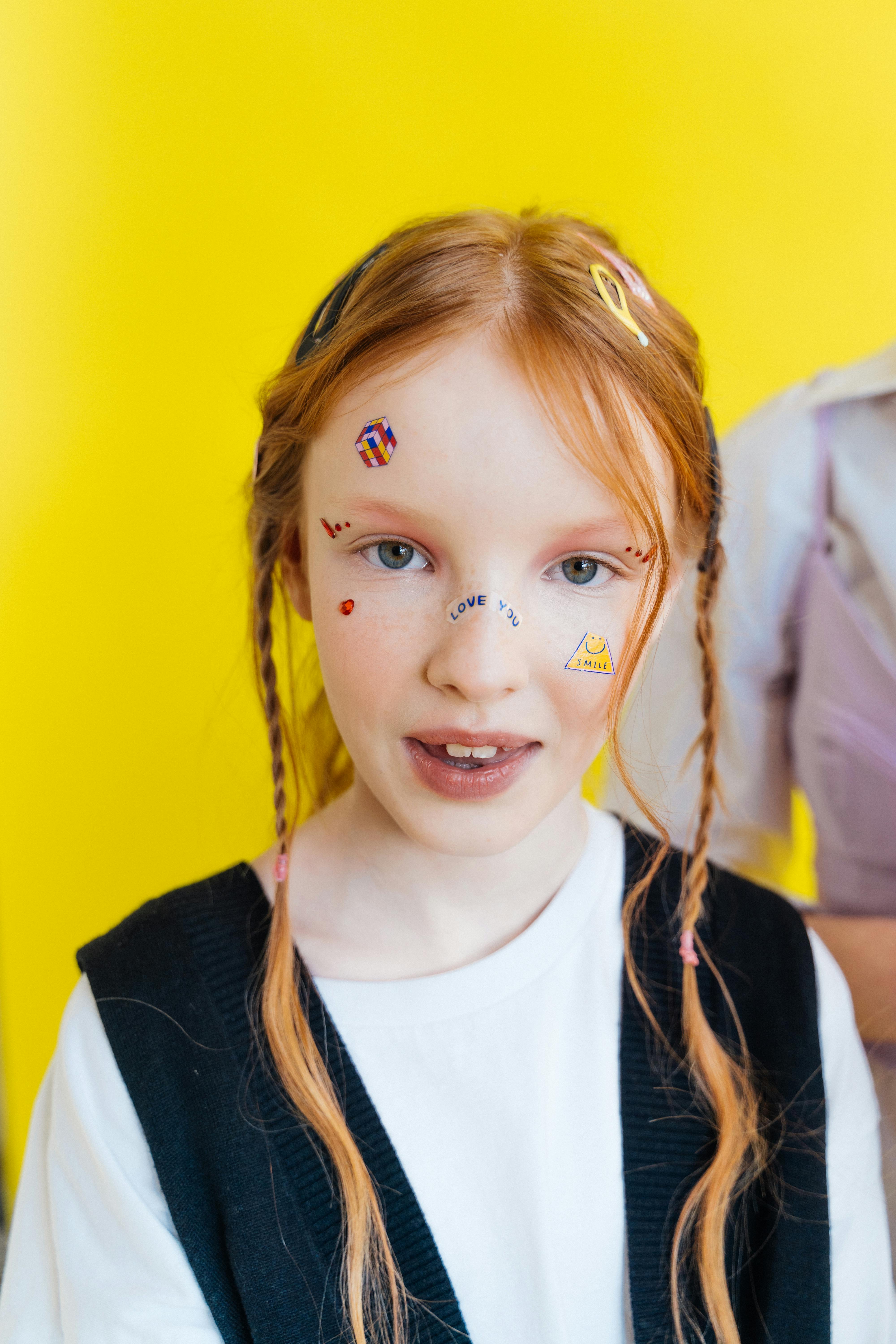 Girl with Cute Stickers on Her Face · Free Stock Photo