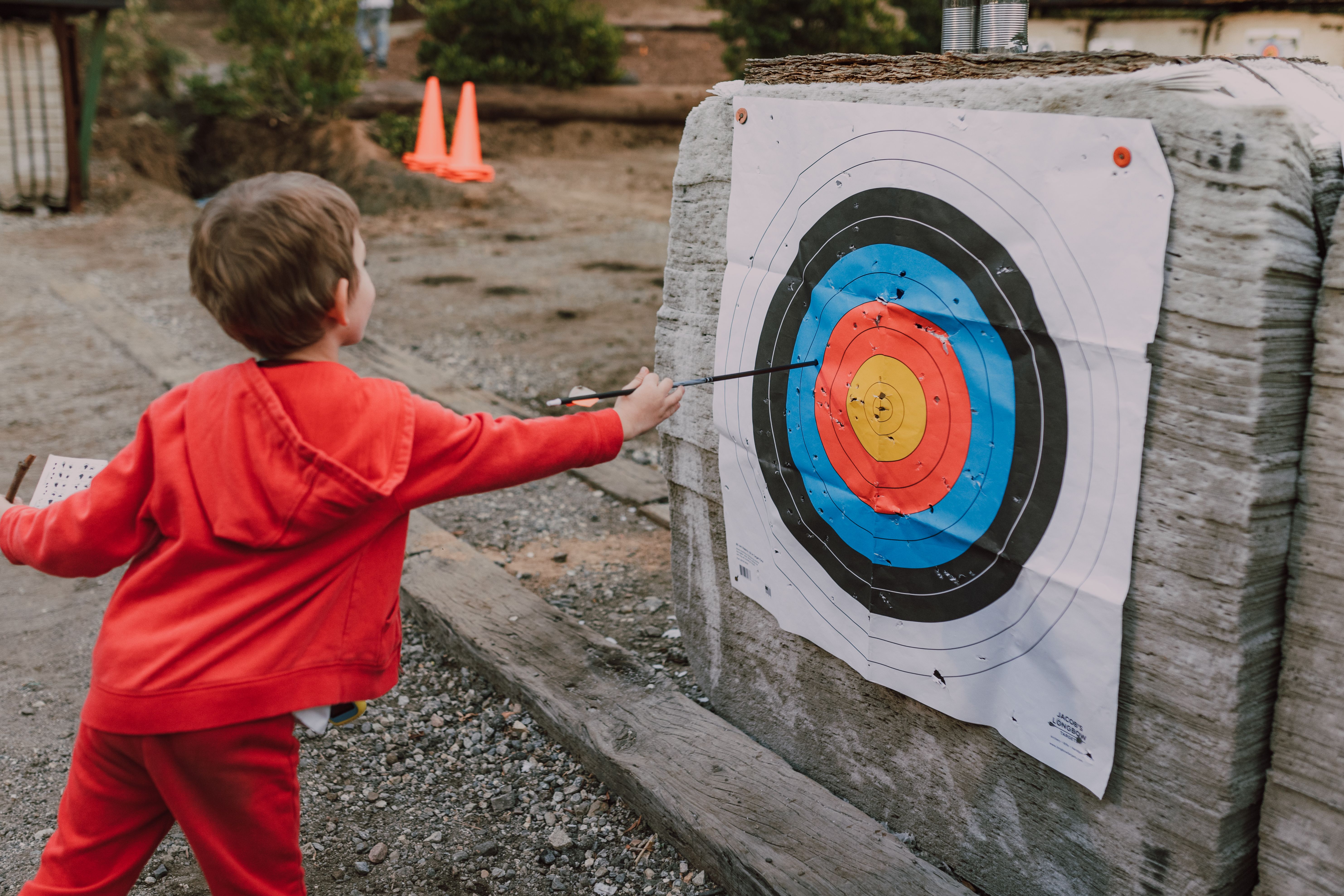 Person Holding a Paper Target · Free Stock Photo