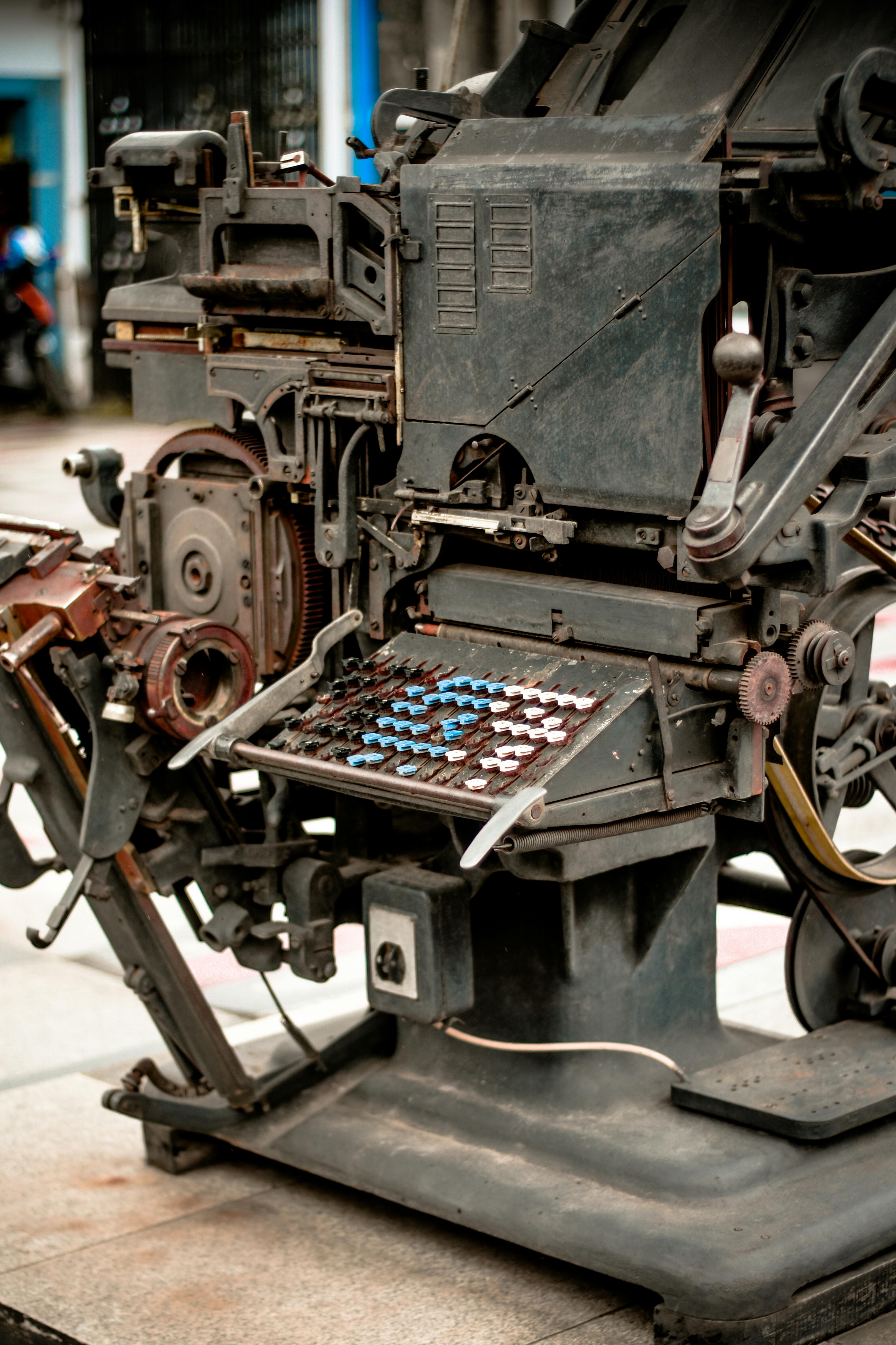 Man Writing on an Old Type Machine · Free Stock Photo