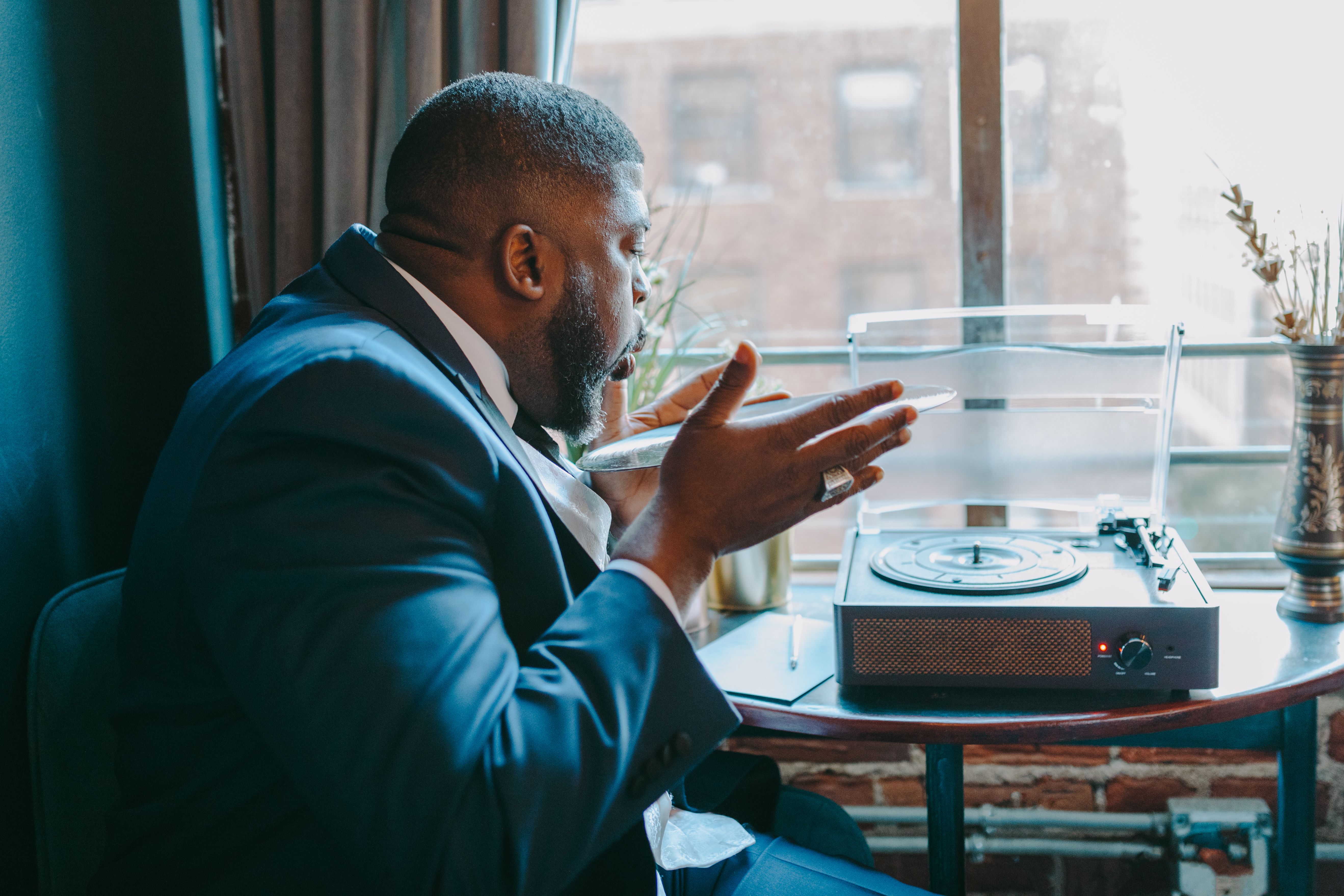 Man Holding Vinyl Record · Free Stock Photo