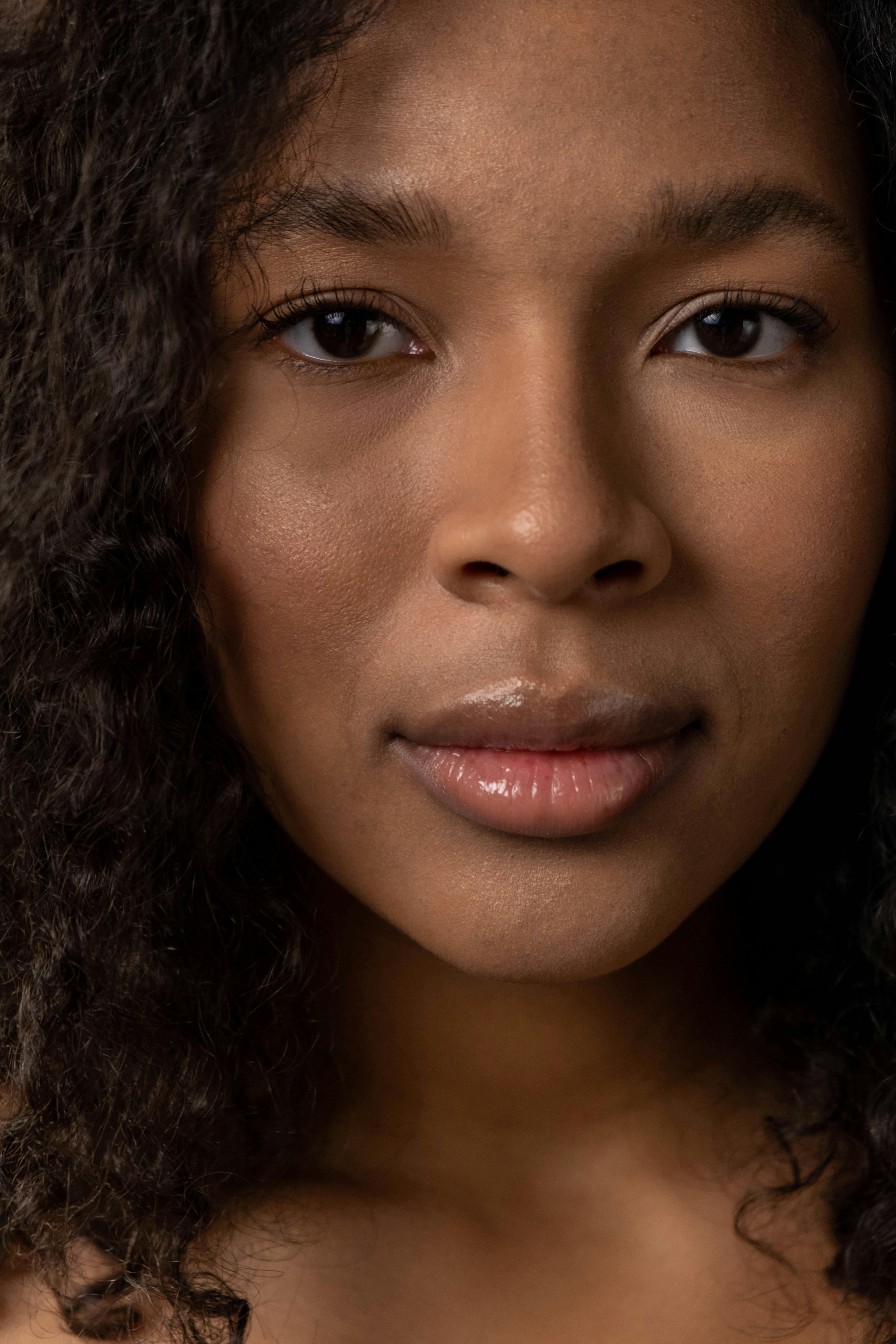 Woman's Face Leaning on a Person's Bare Back · Free Stock Photo