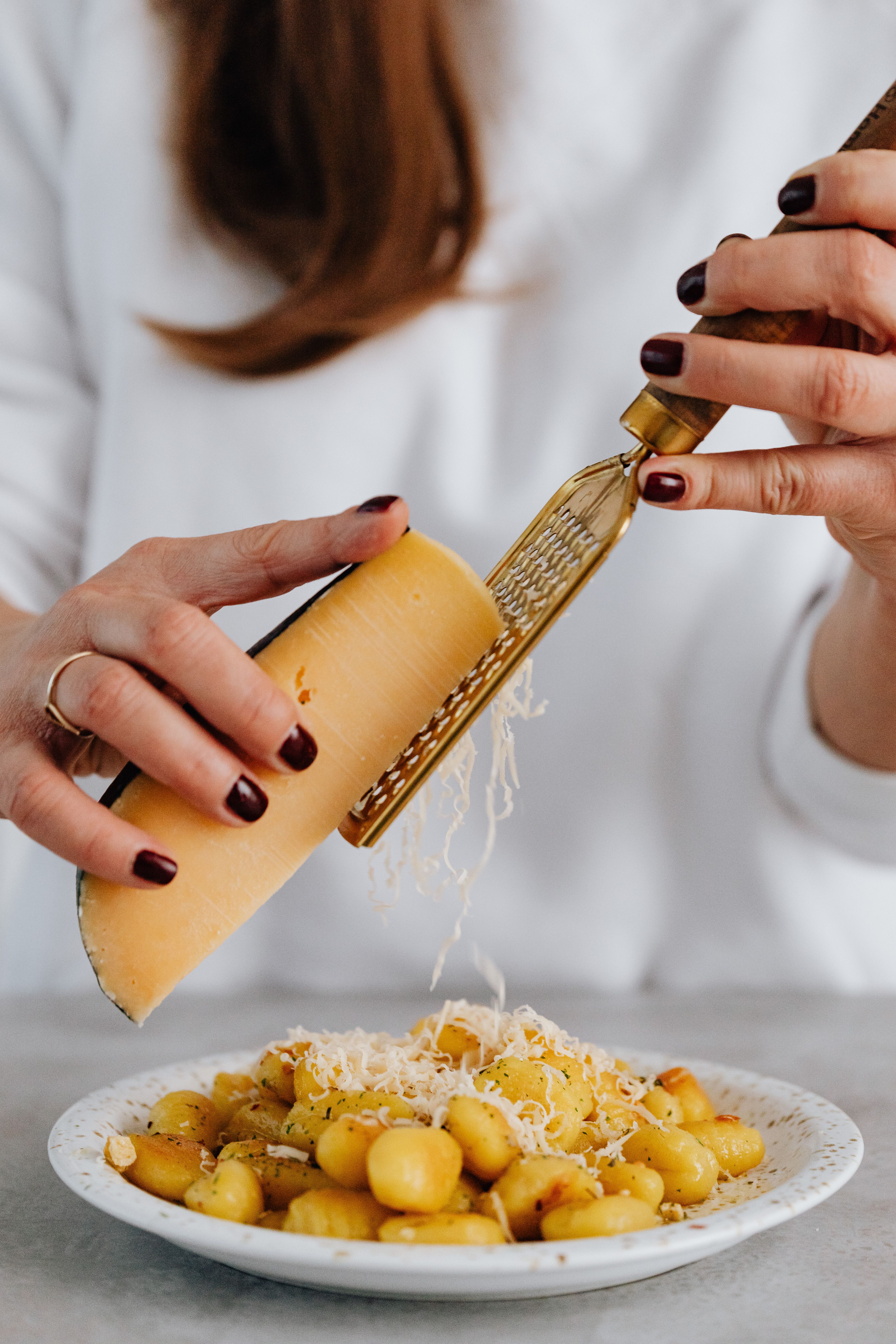 A Person Grating a Cheese · Free Stock Photo