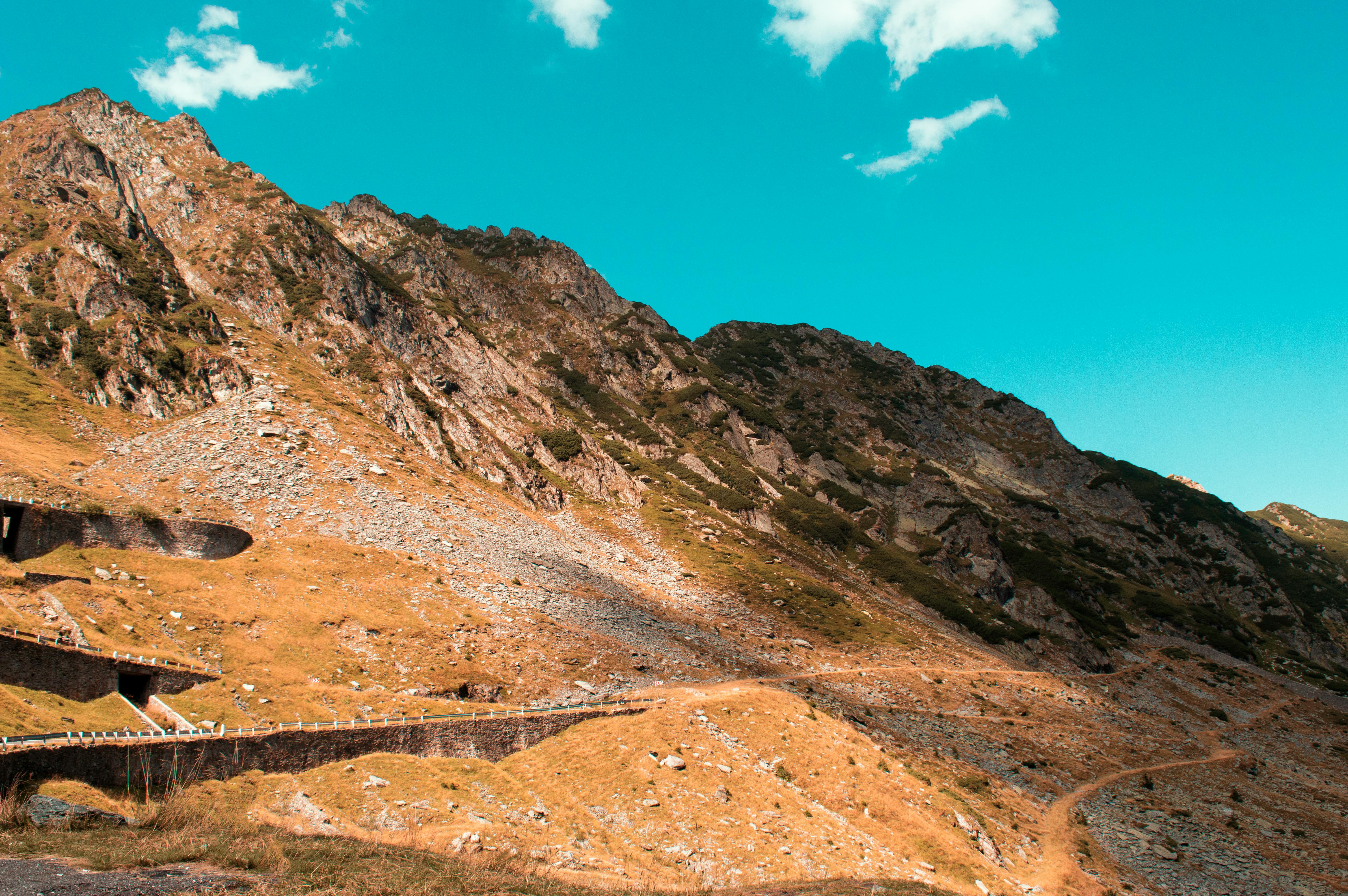 Brown Rock Mountains Under the White Clouds · Free Stock Photo