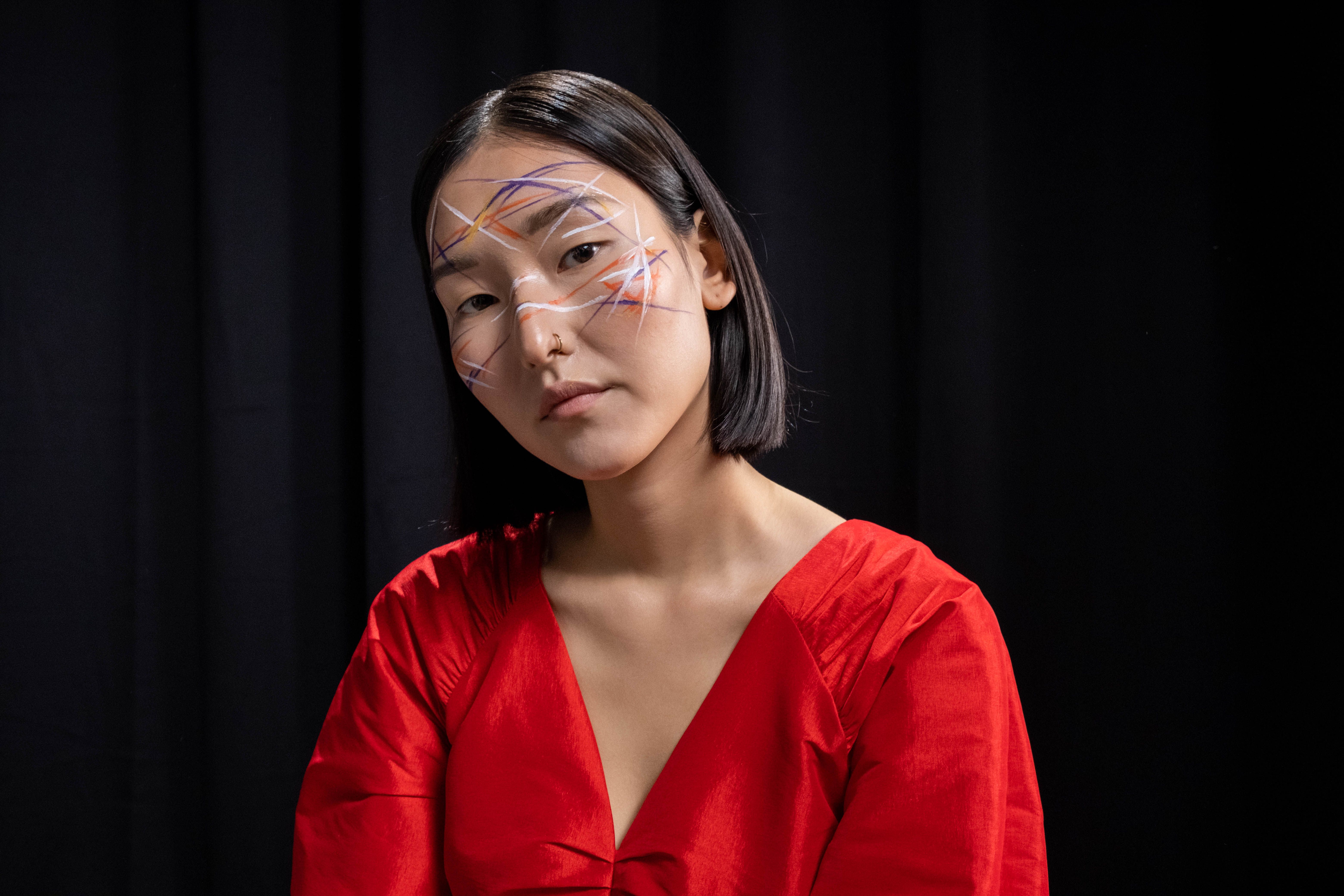 Person With Yellow Face Paint · Free Stock Photo