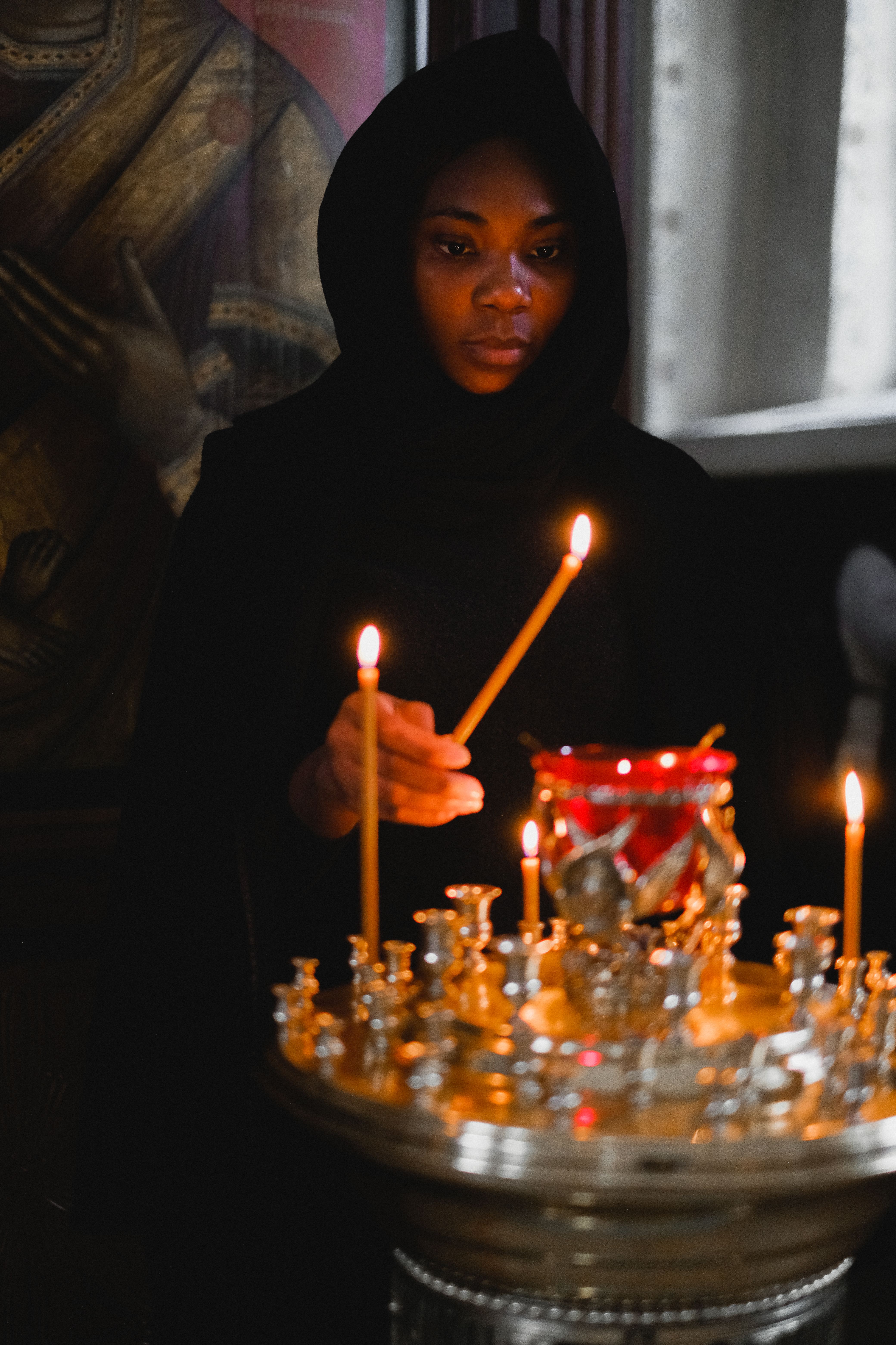 Woman in Black Clothes Holding Lighted Candle · Free Stock Photo
