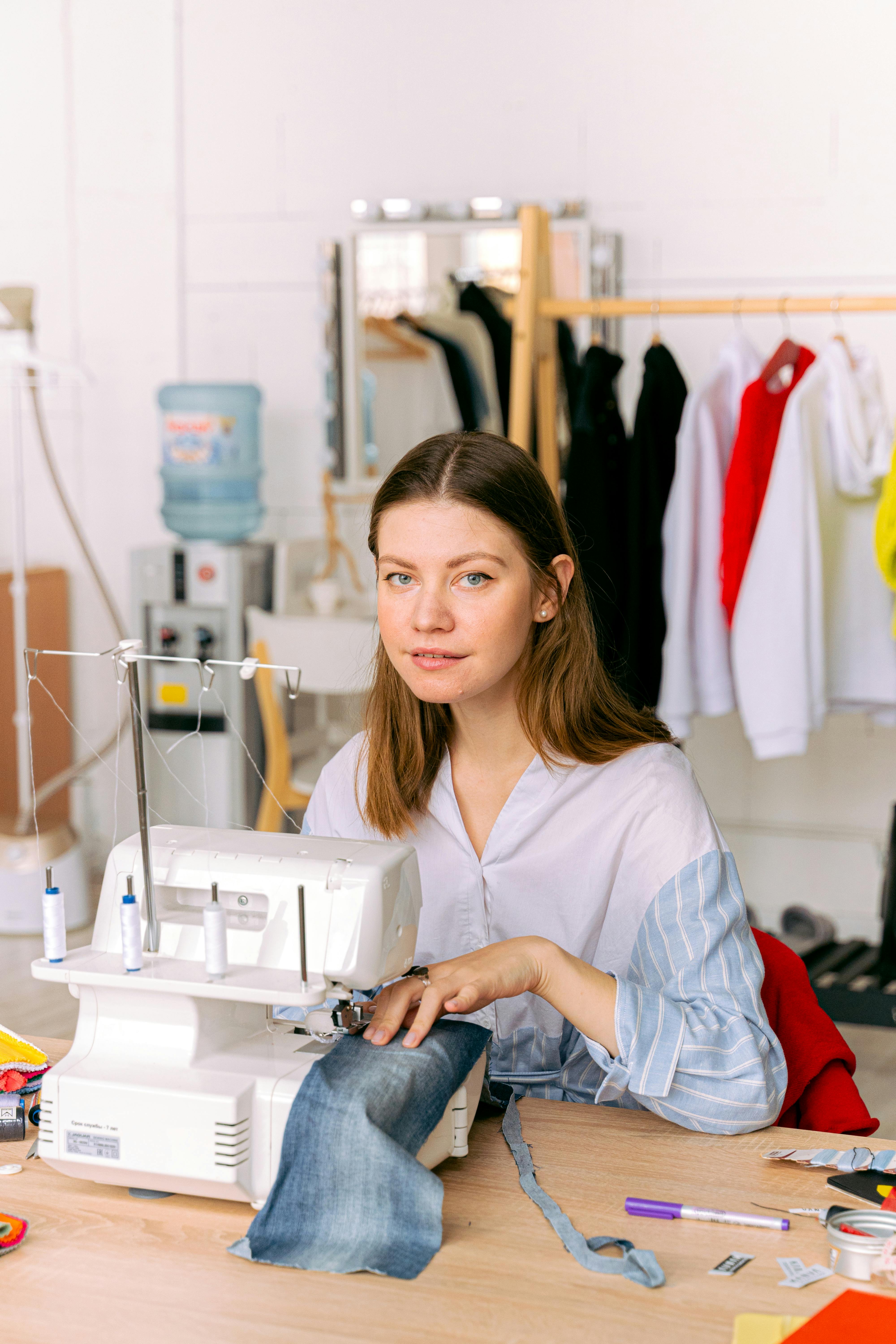 A Woman Using a Sewing Machine · Free Stock Photo