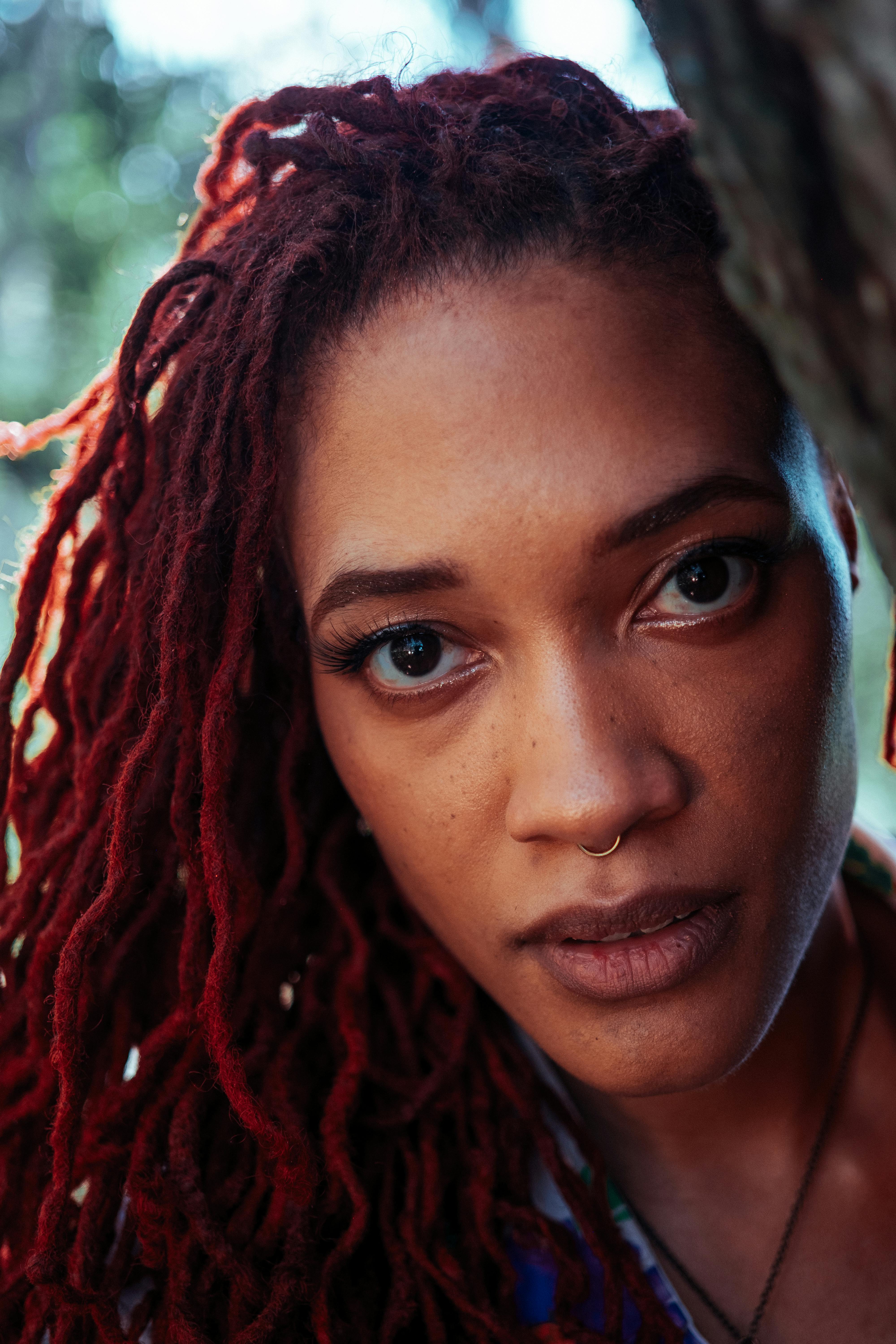 Portrait of a Woman with Red Dreadlocks Looking at the Camera · Free ...