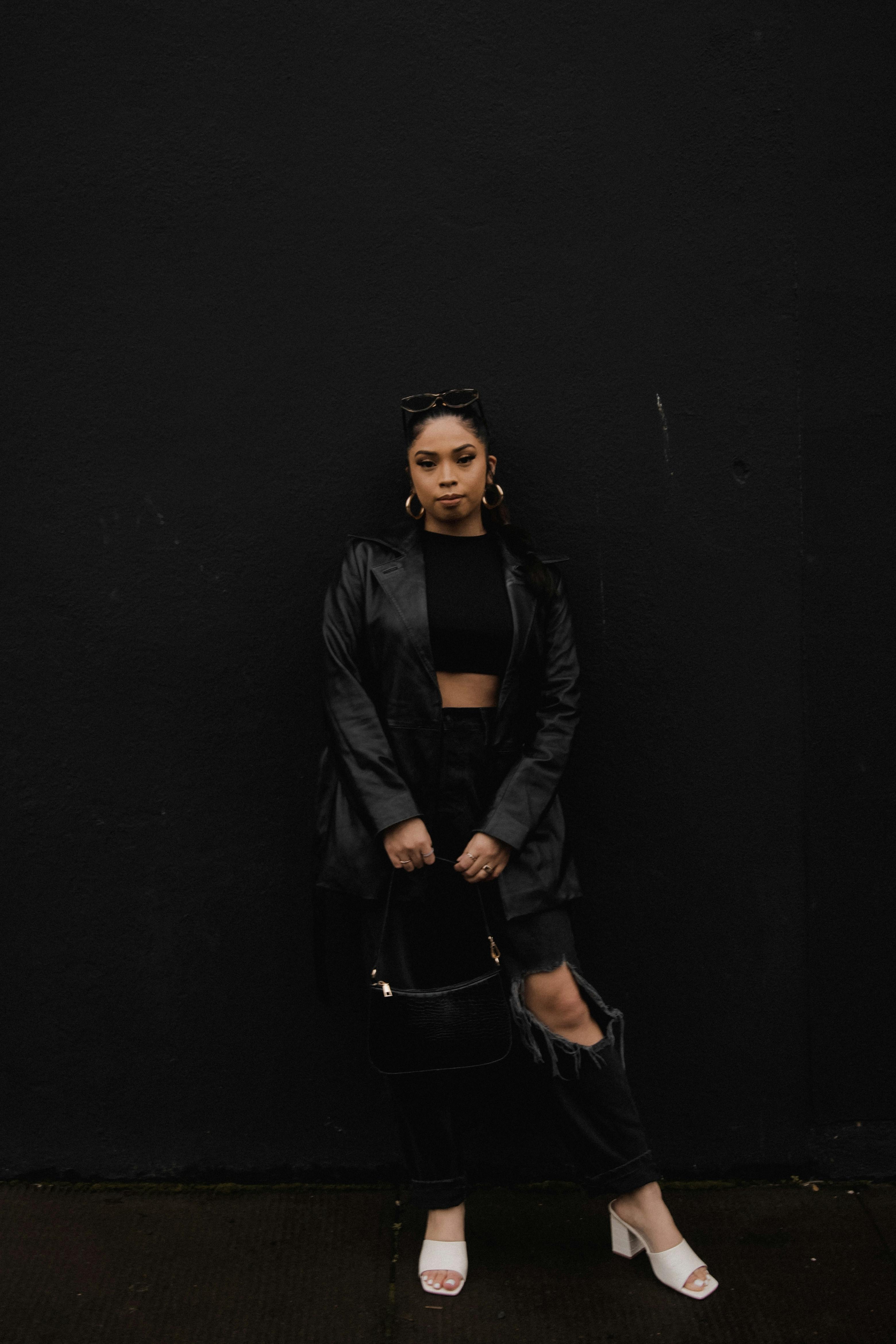 A Woman in Black Leather Jacket Wearing Black Mask · Free Stock Photo