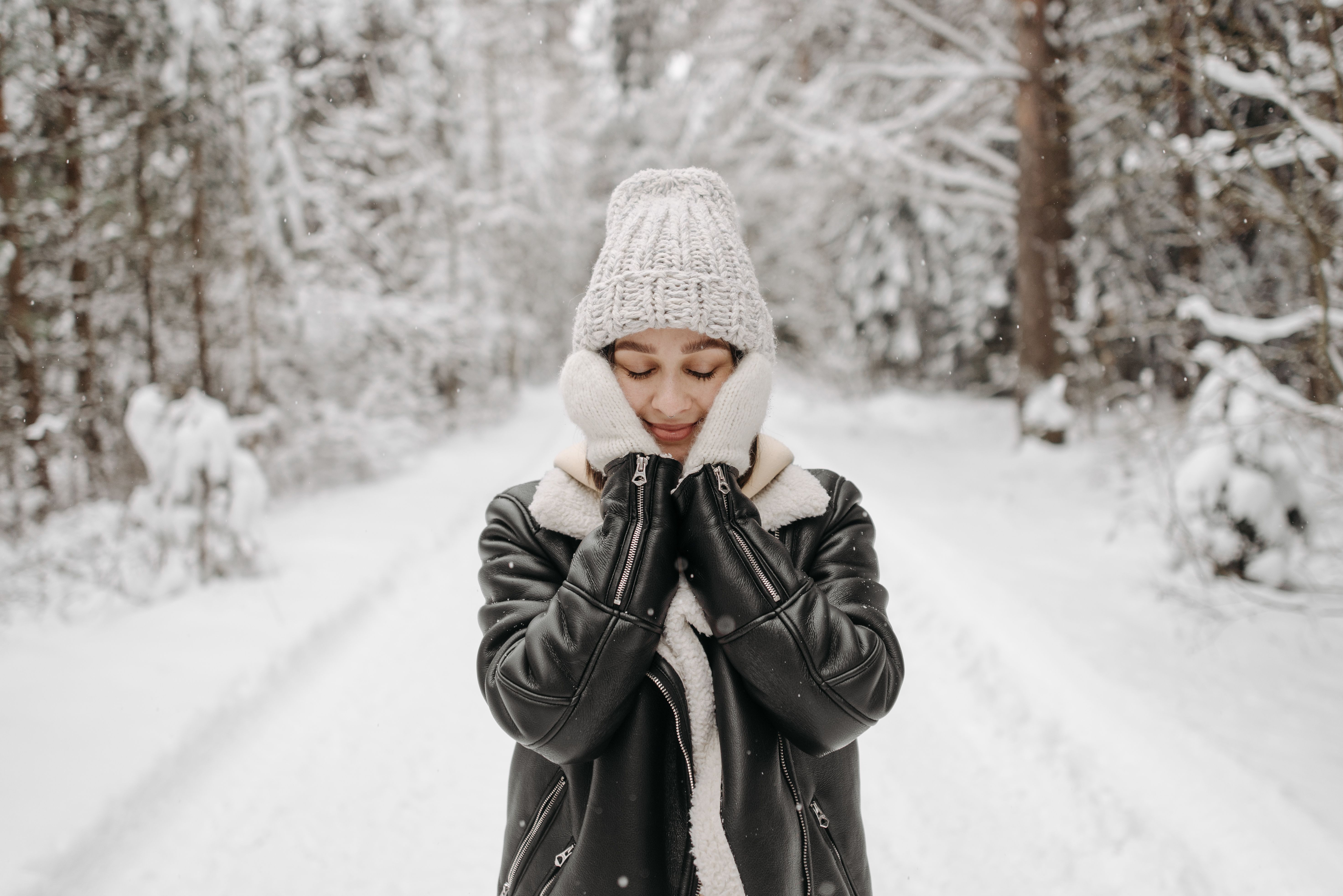 Woman in Black Leather Jacket Wearing Beanie Hat and Gloves During Now ...