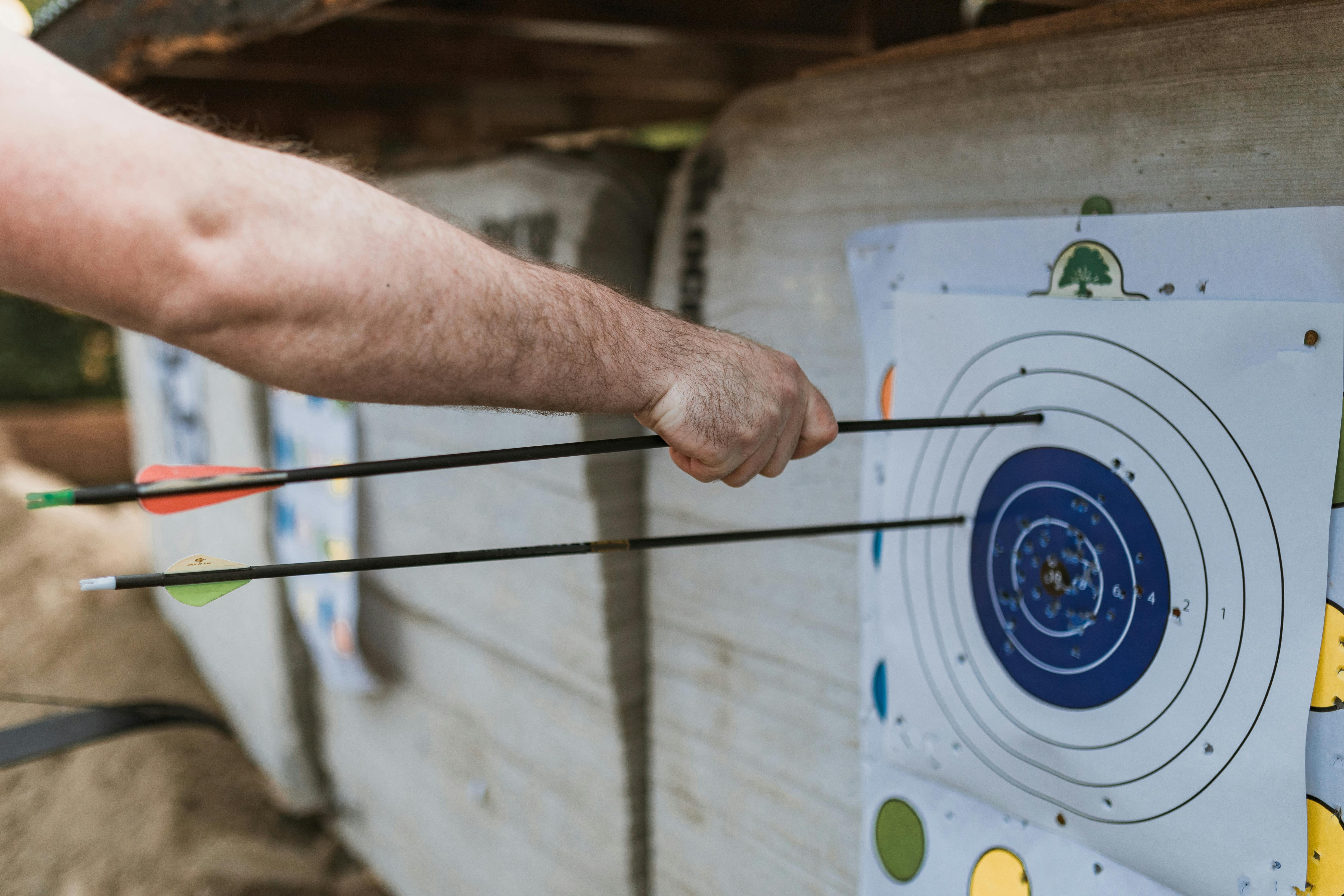 Close-up Photo of Arrows on an Archery Target · Free Stock Photo