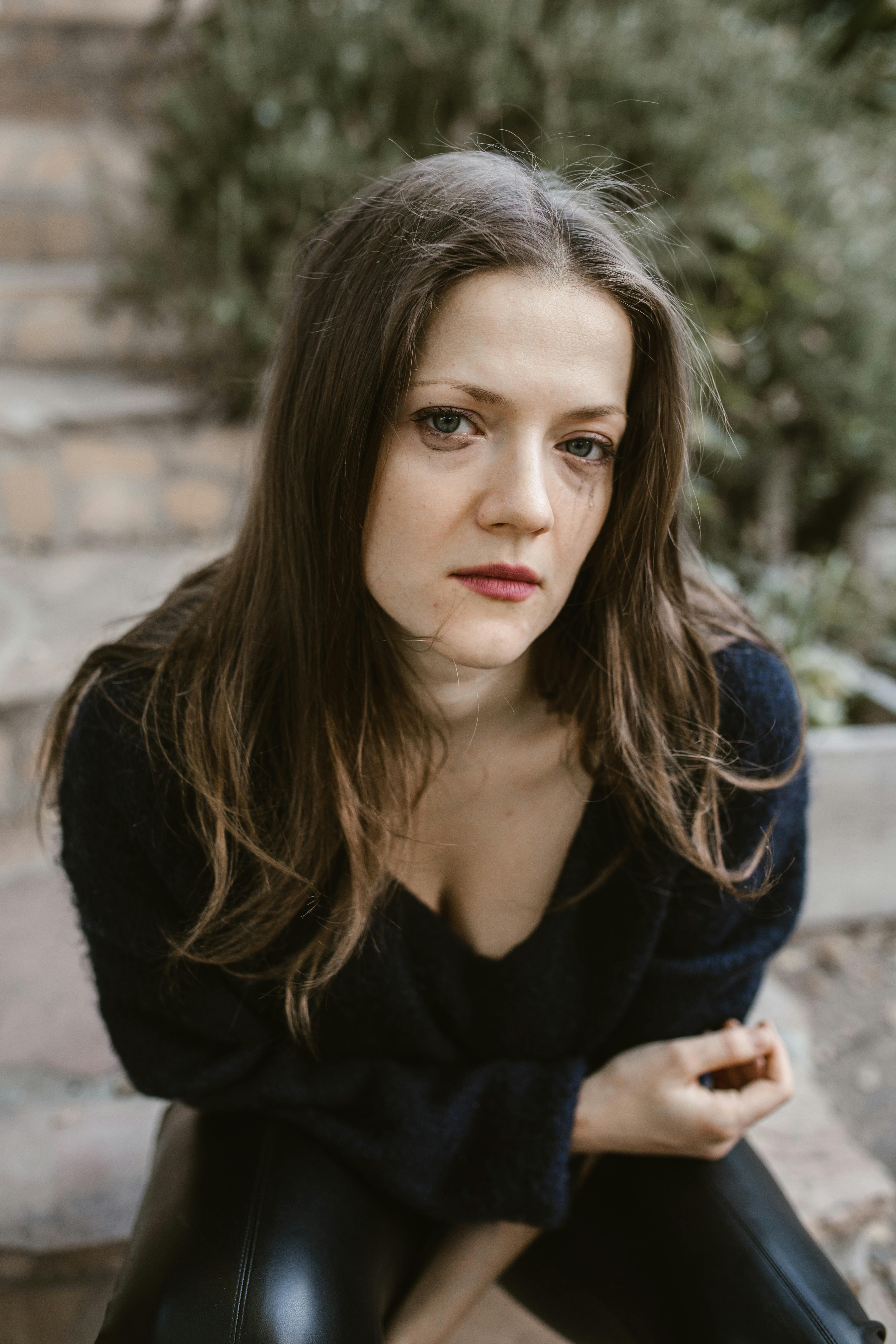 Photo of a Woman Crouching while Her Hands are on Her Head · Free Stock ...