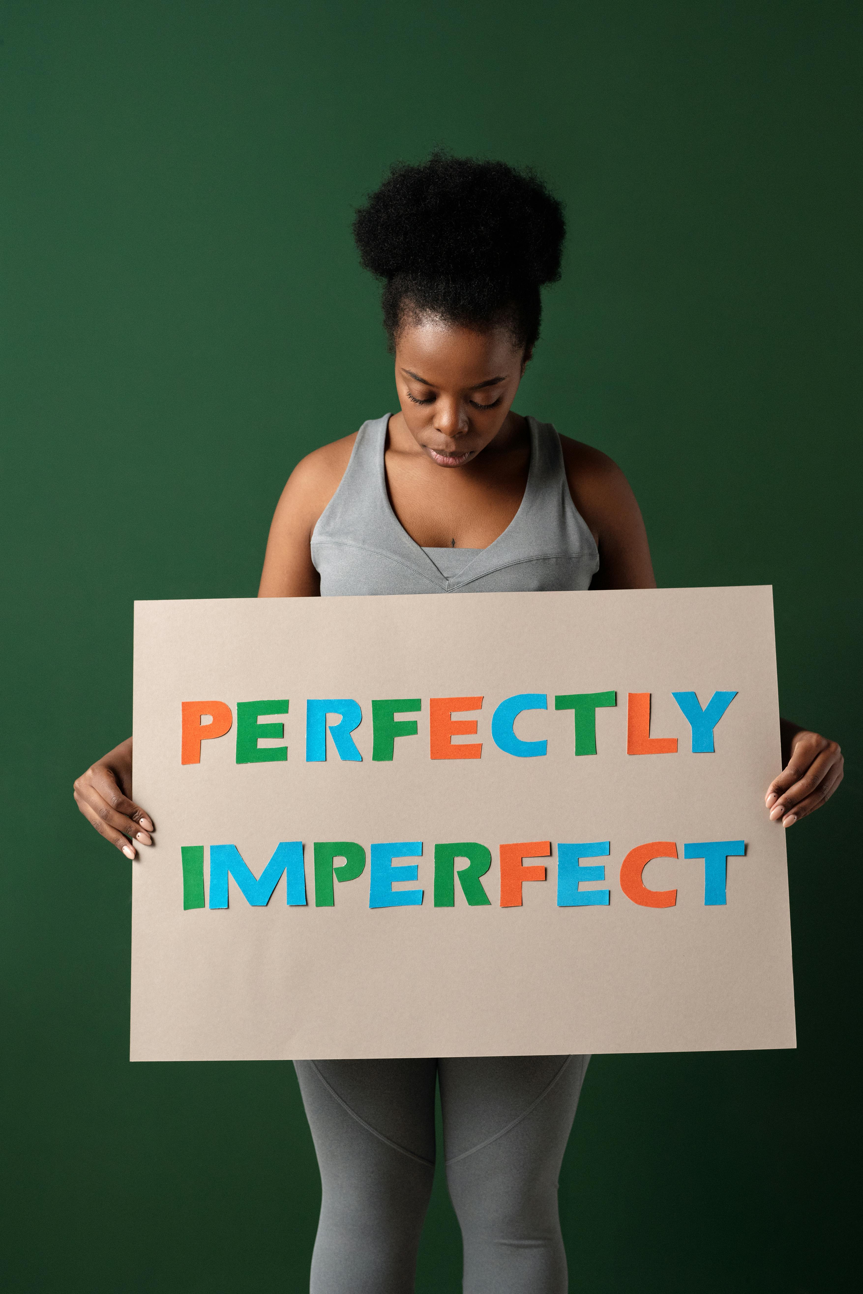 A Woman Holding a Slogan About Obesity · Free Stock Photo