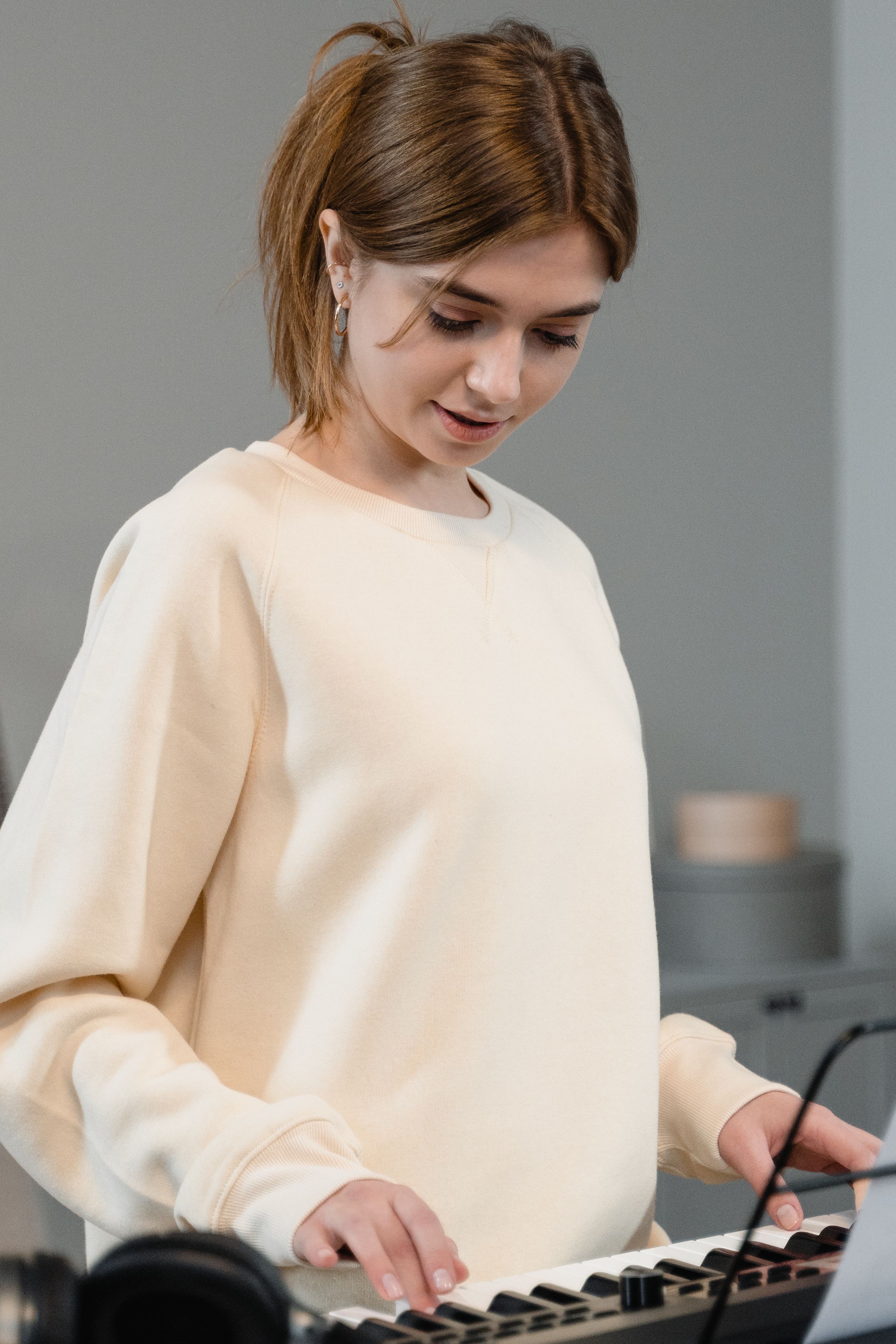 A Woman Playing the Keyboard · Free Stock Photo